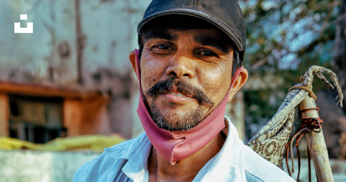 A Man With A Pink Scarf Around His Neck Photo Free Human Image On