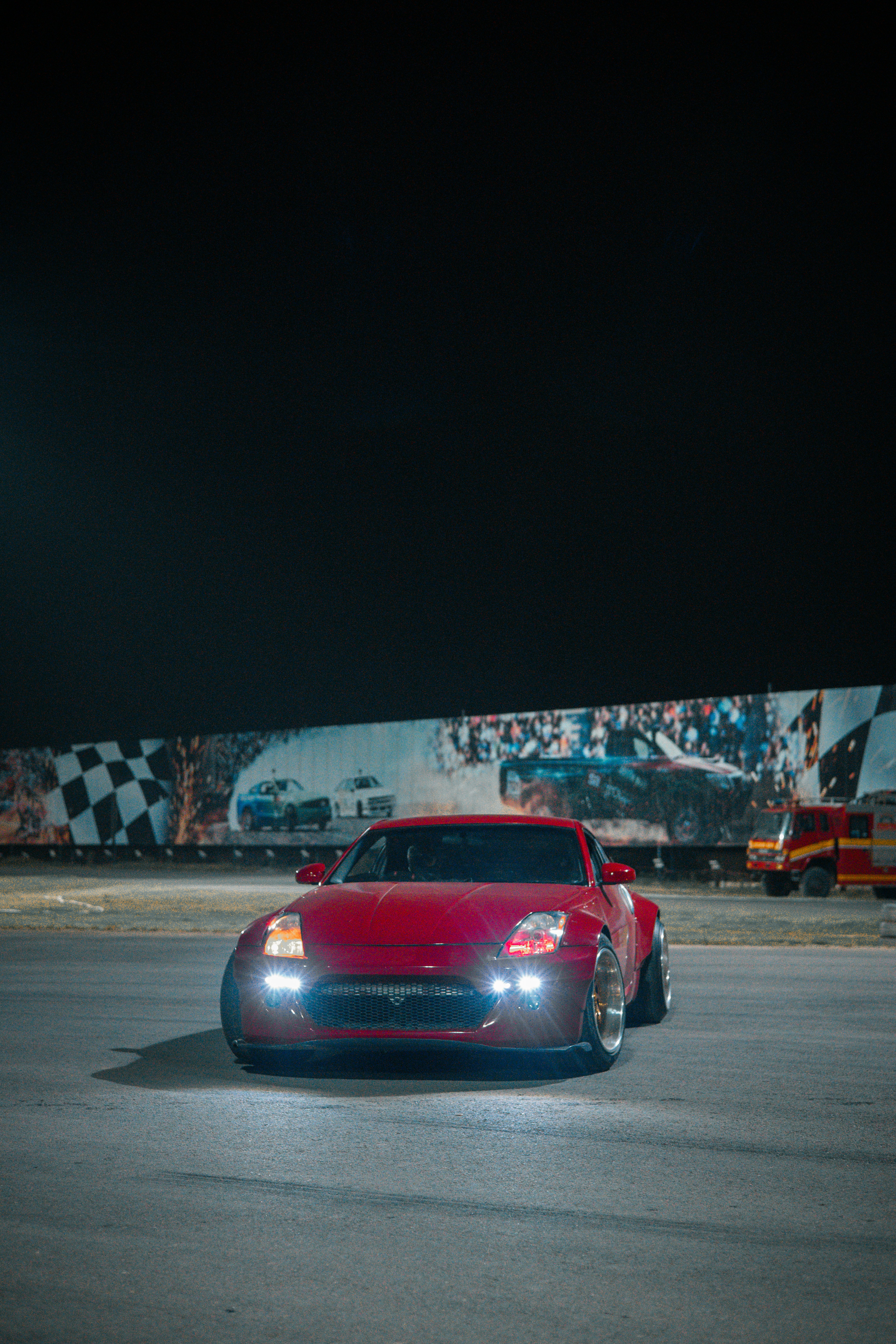 Midnight Drive: Red Car Under City Lights