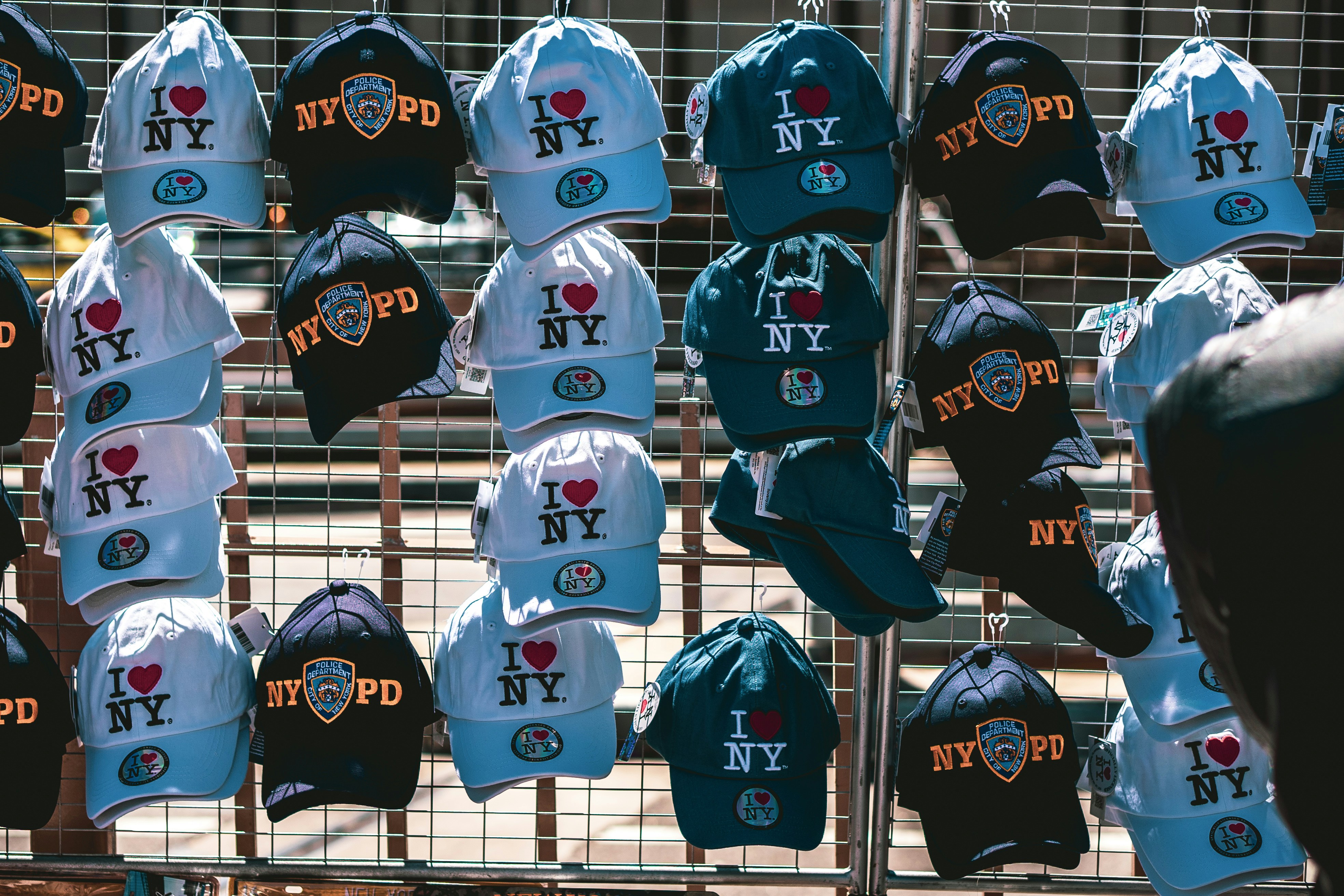 A bunch of hats that are on a rack photo – Free Tourist trap Image on ...