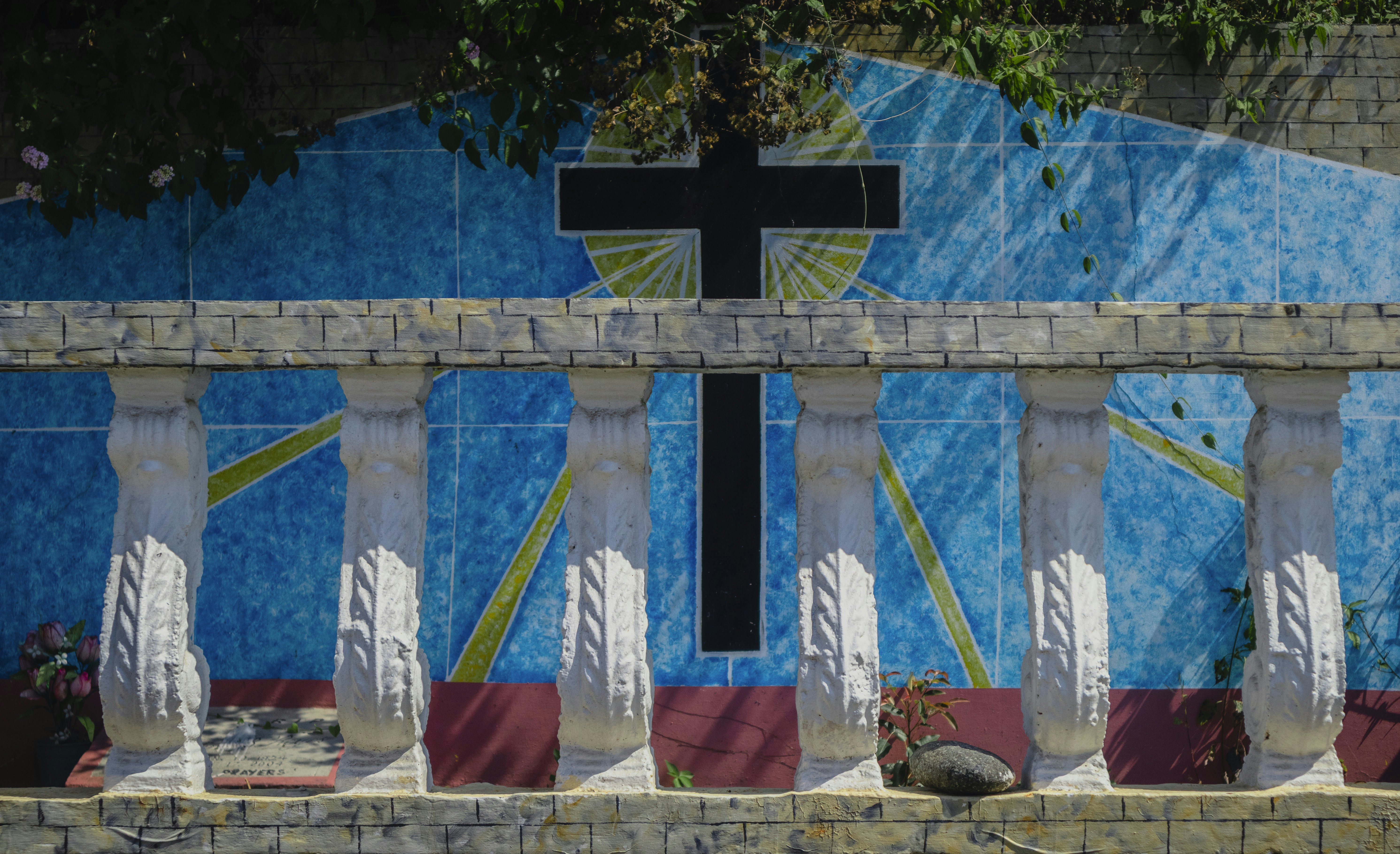 Crossing Shadows: A Sacred Silhouette Behind the Colonnade