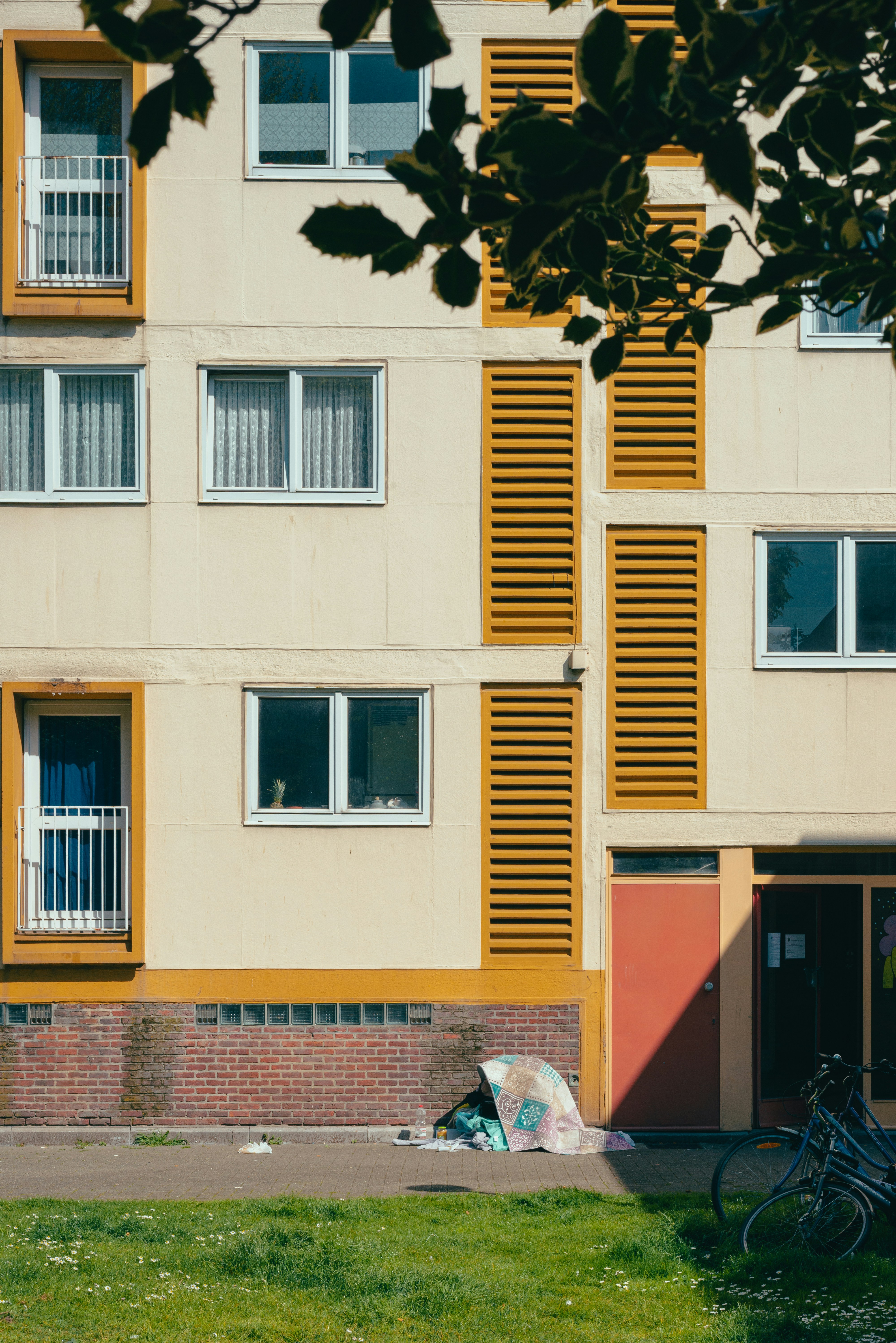 a bike parked in front of a tall building