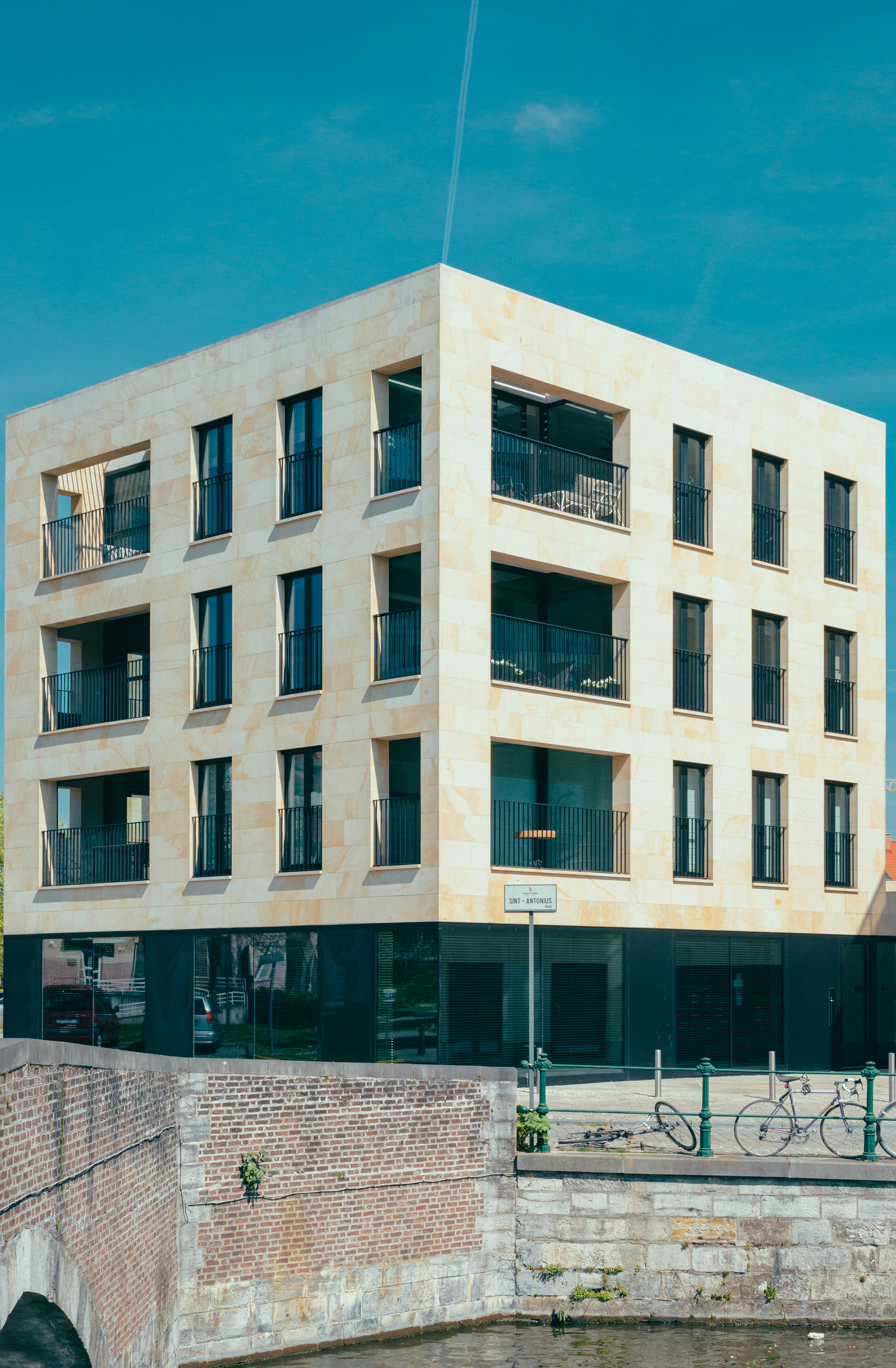 a large building with a bridge in front of it