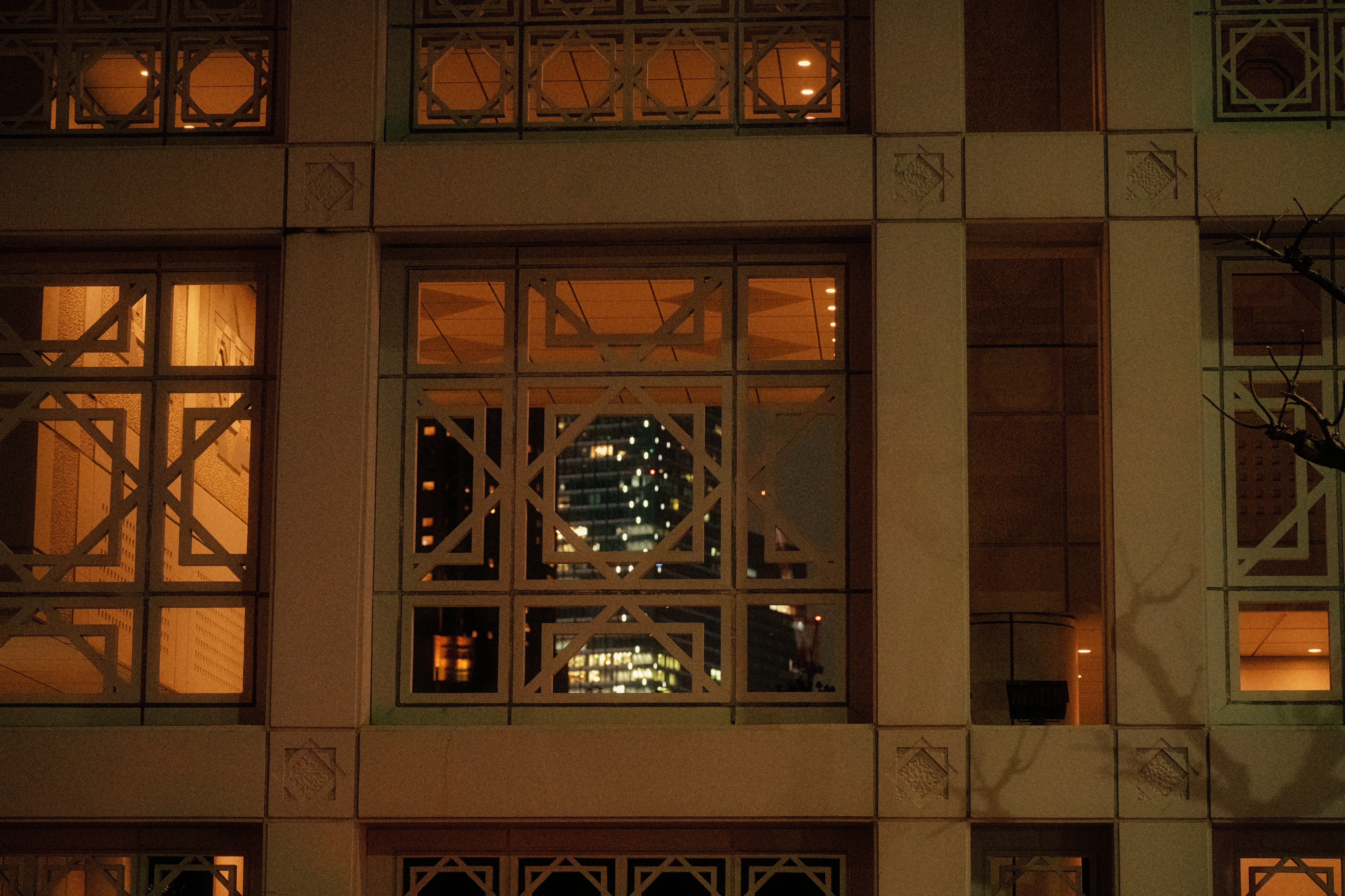Geometric Lanterns: A Bank of Windows at Dusk