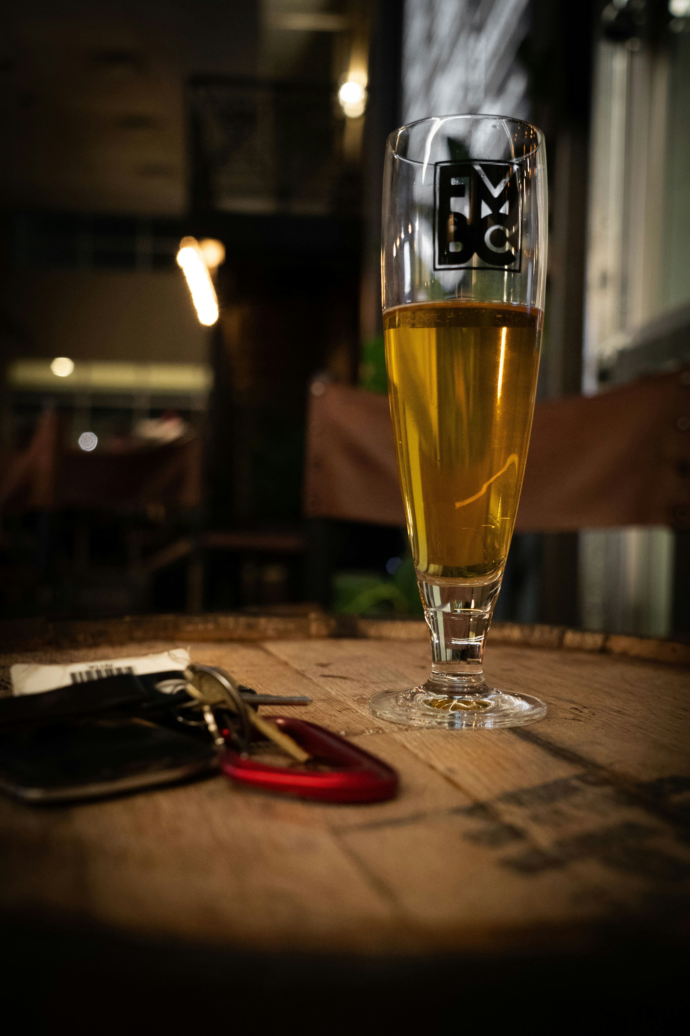Golden Pint on Weathered Wood in a Quiet Bar