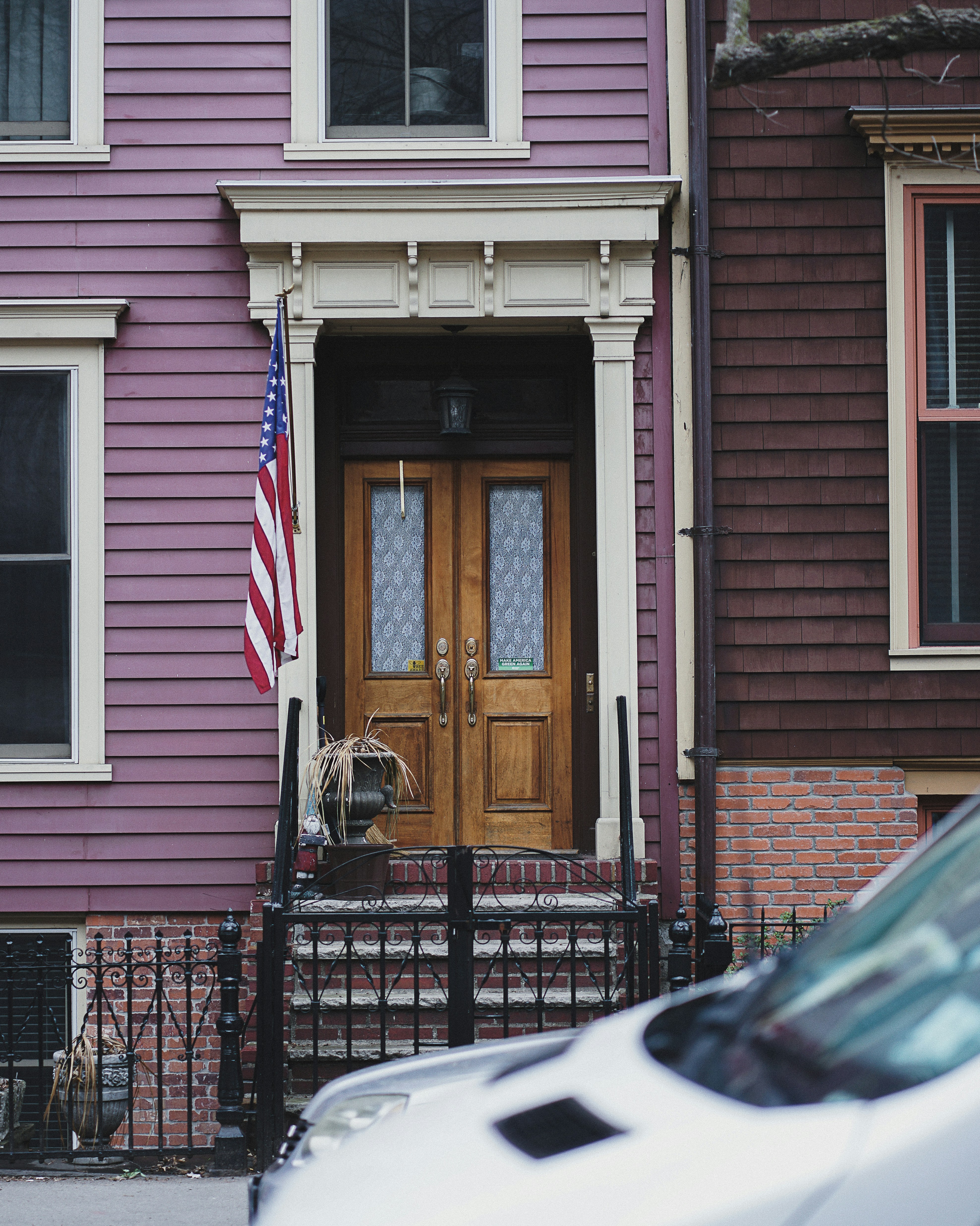 a car parked in front of a purple house