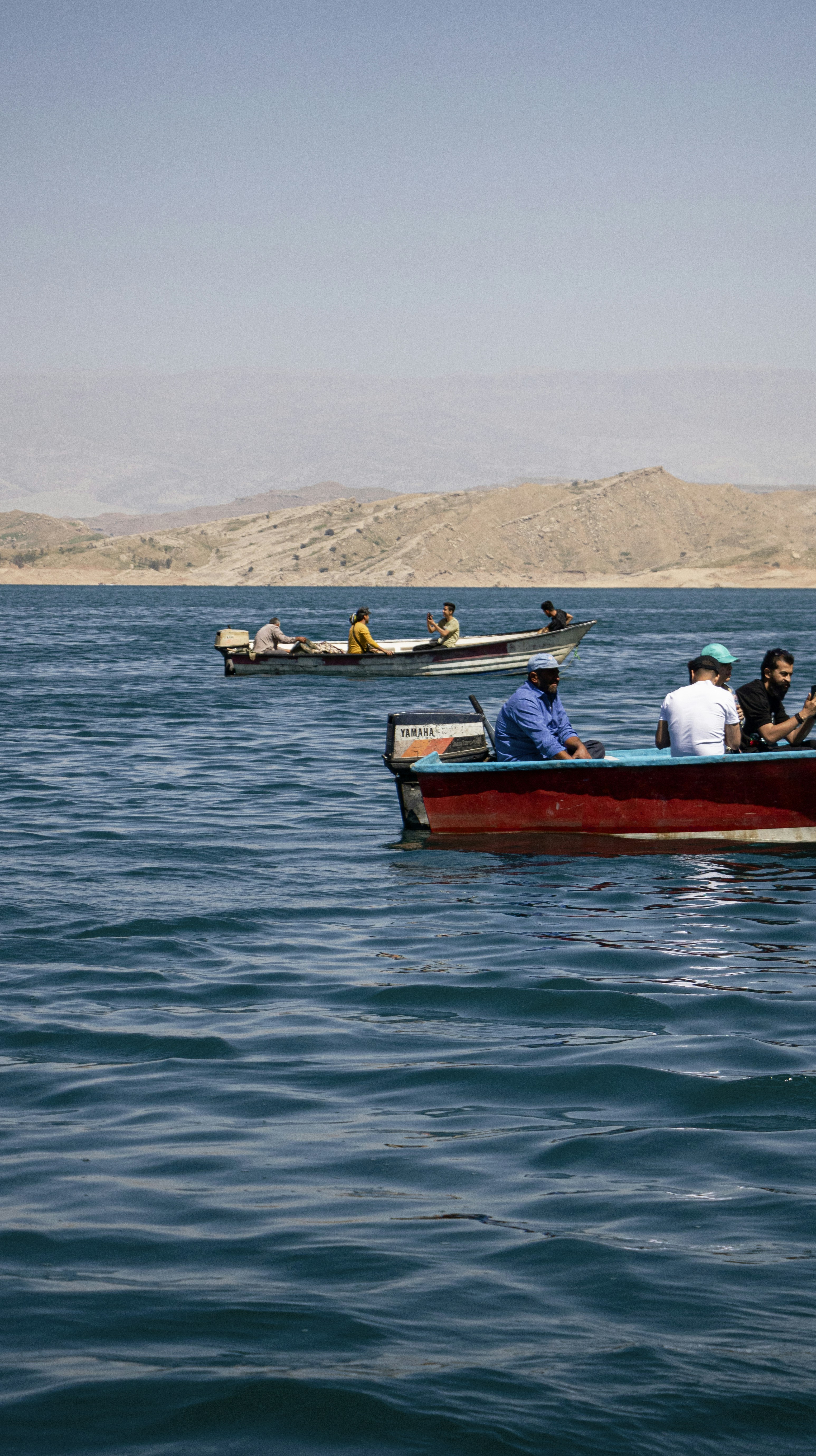 A group of people in a small boat on the water photo – Free Dezful ...