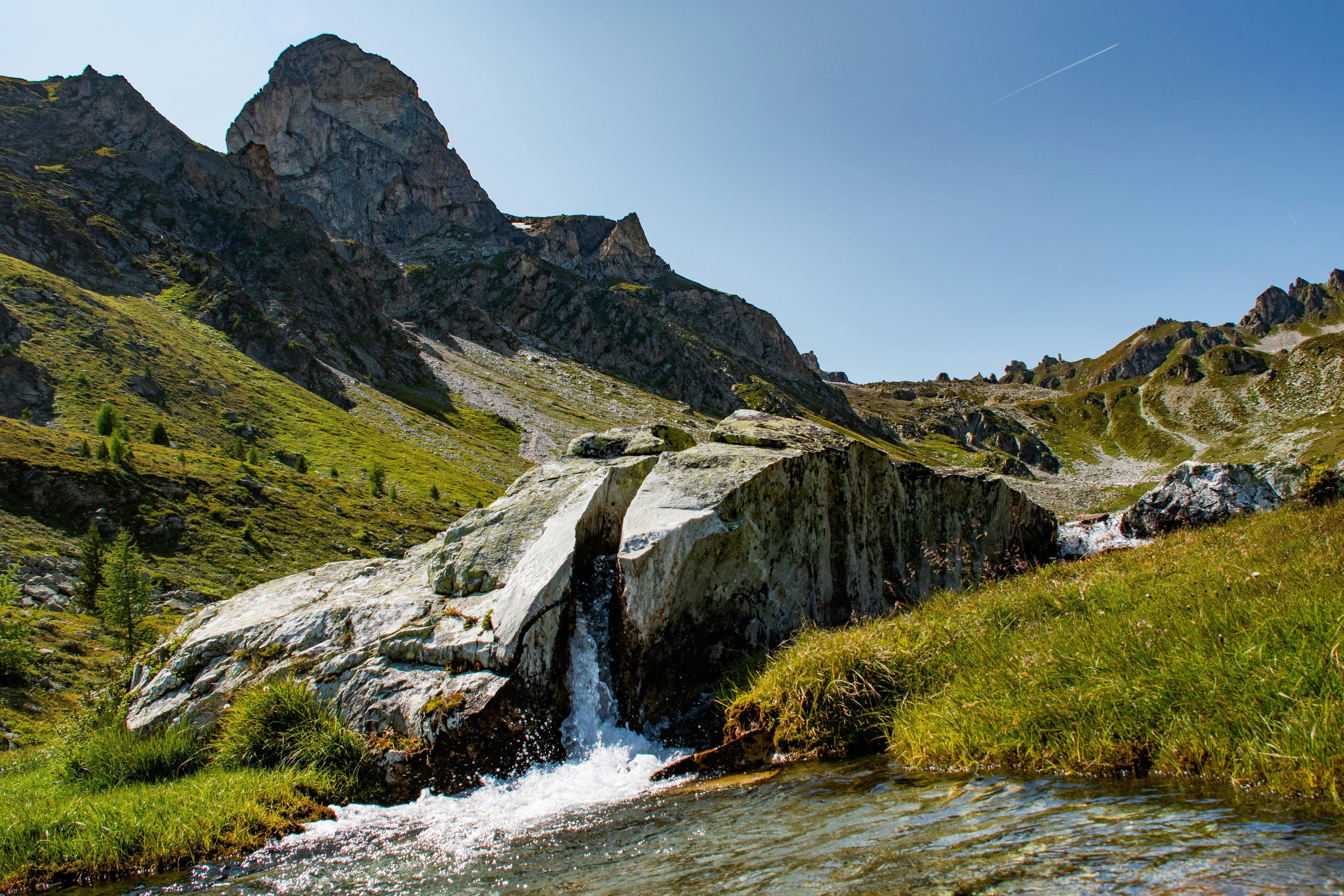 A stream running through a lush green hillside photo – Free Turtmanntal ...