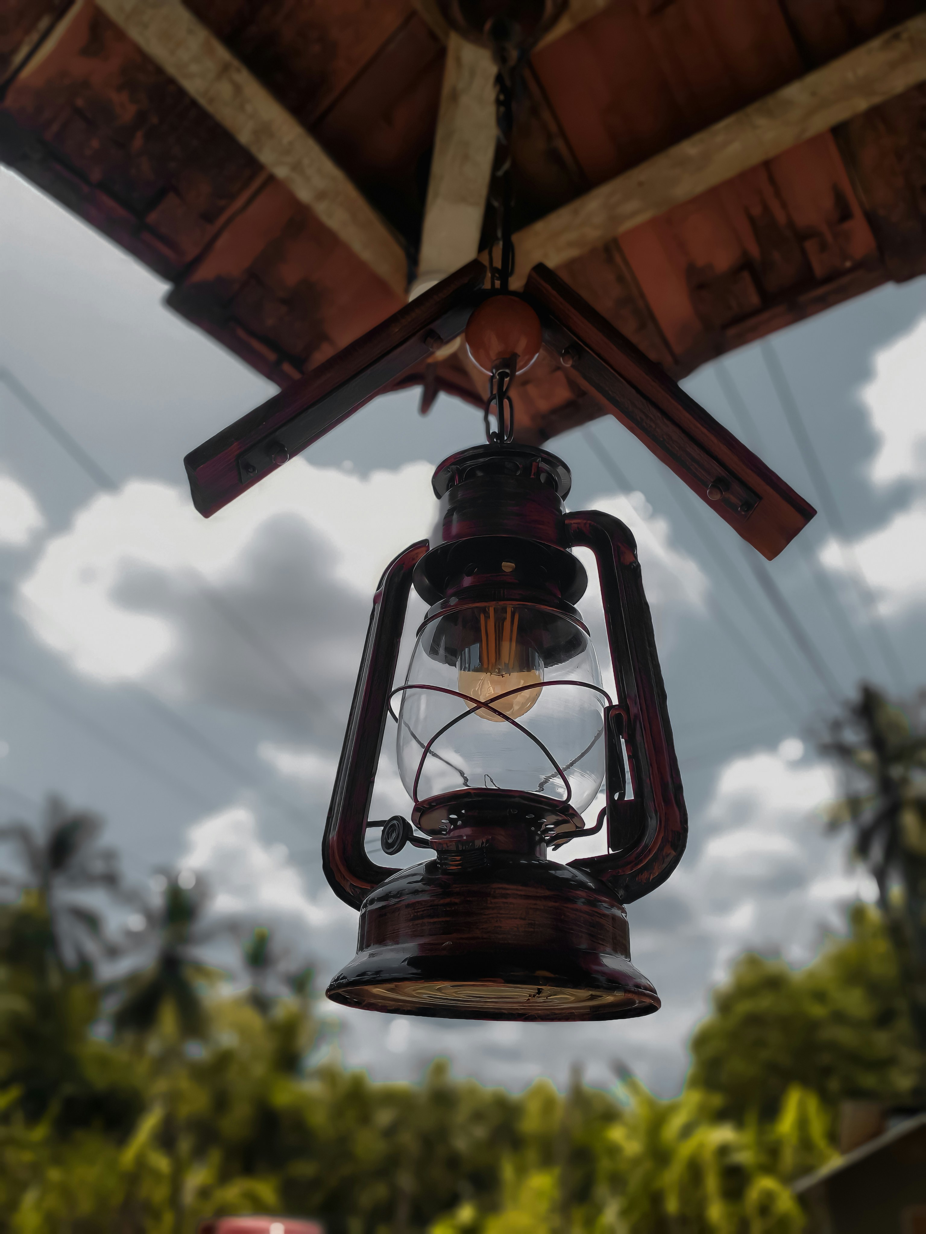 Hanging Lantern Under a Wooden Roof