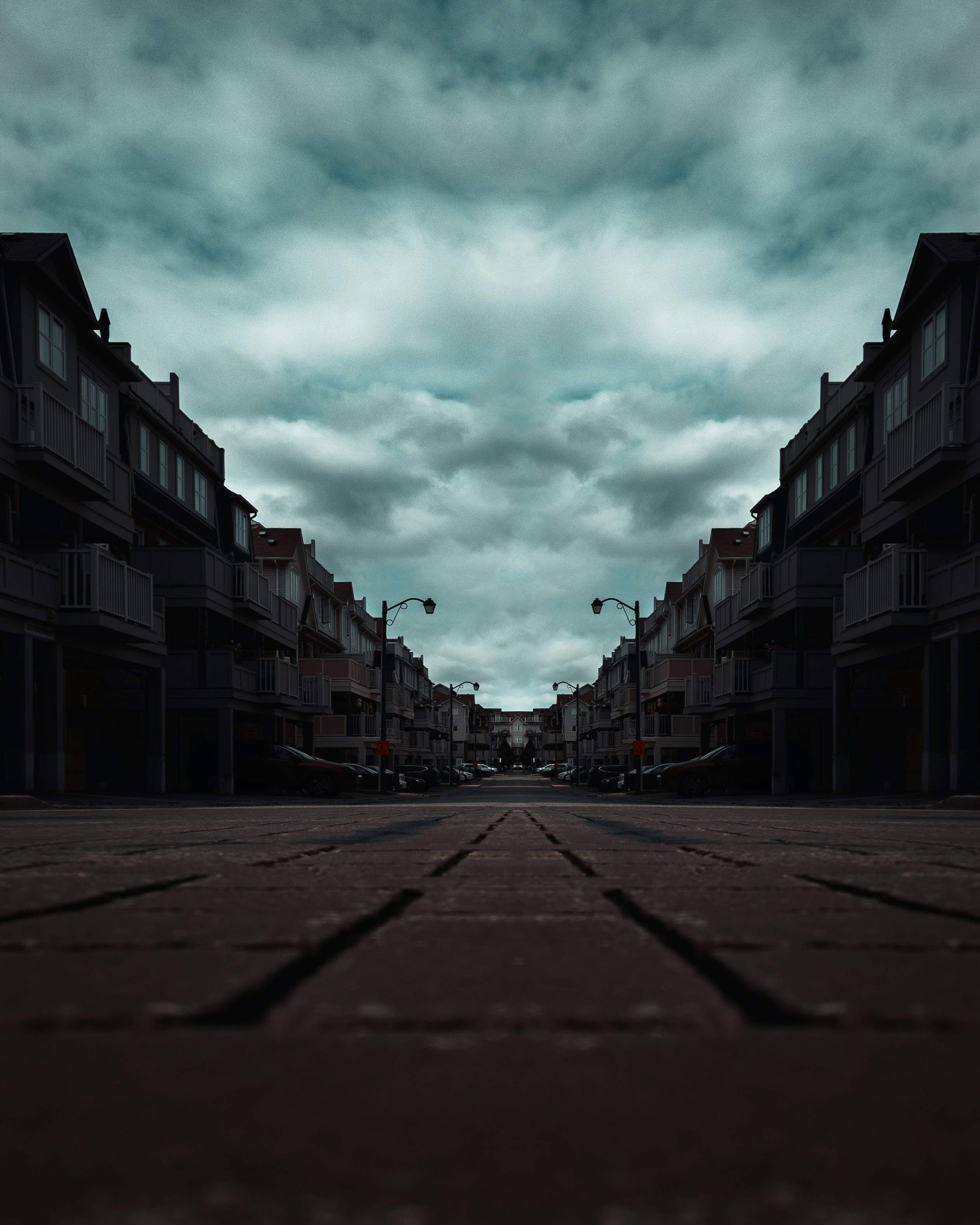 An empty street in a city under a cloudy sky photo – Free Lightroom ...