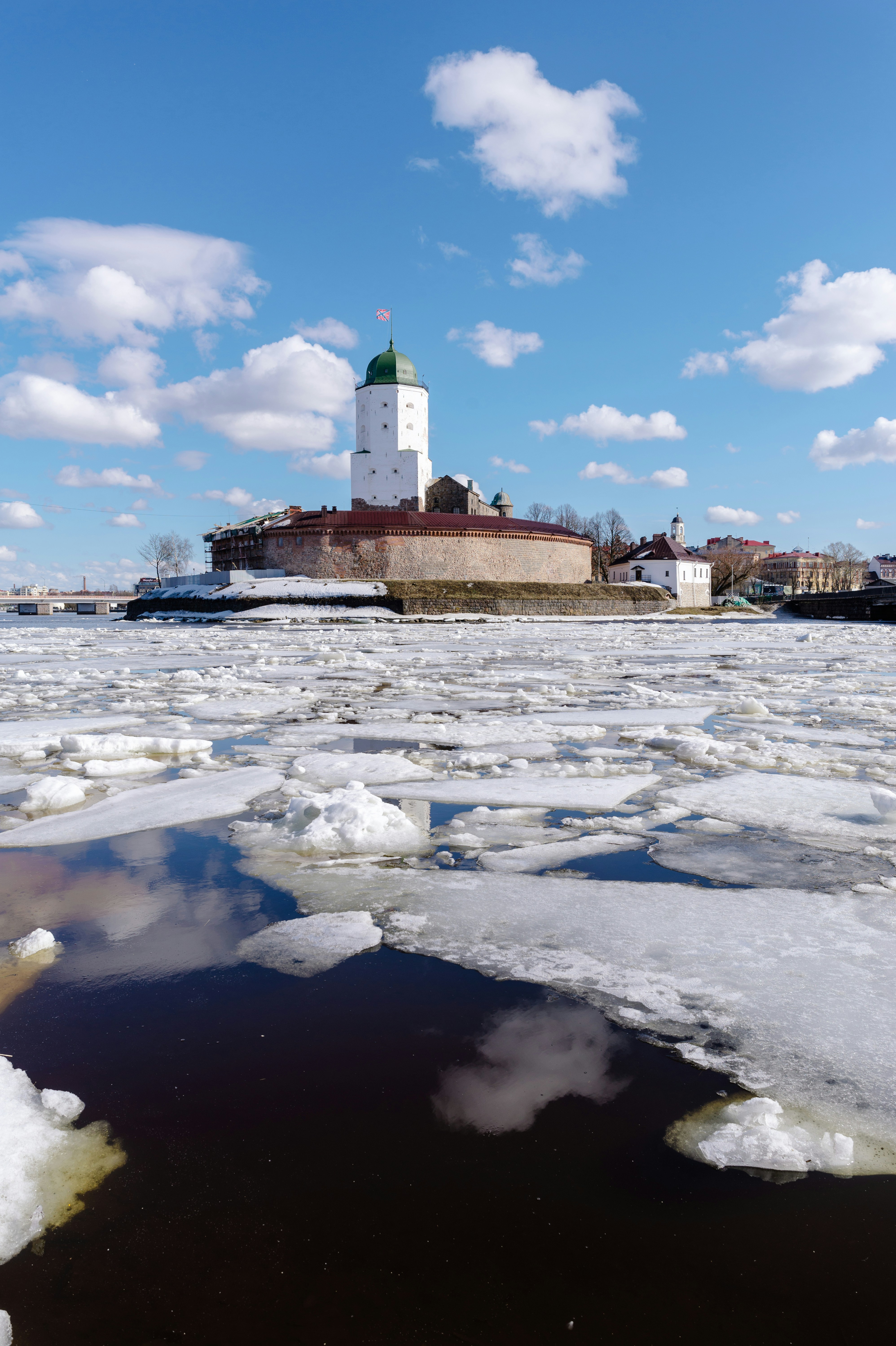 a lighthouse in the middle of a body of water