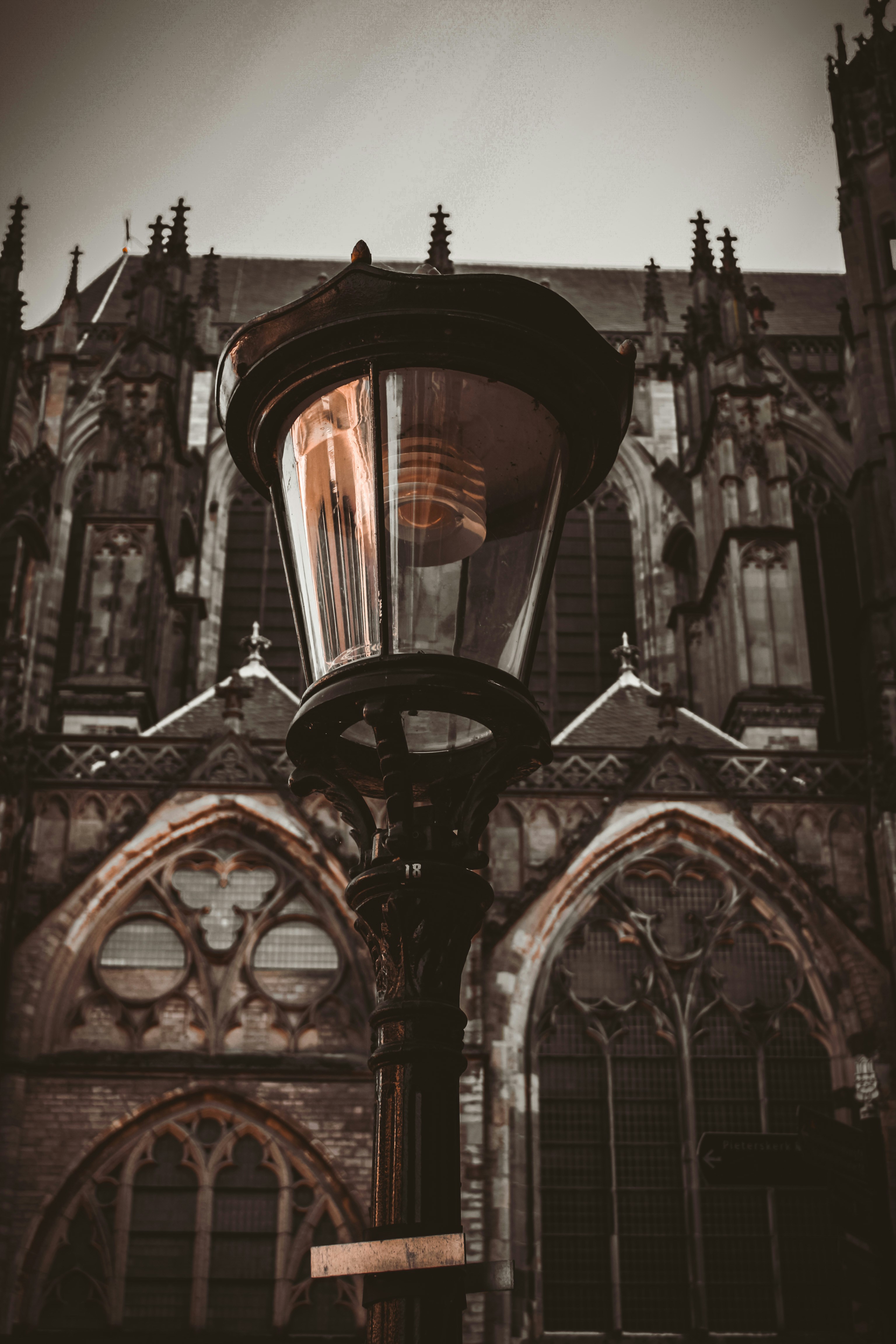 Lantern in Sepia: A Gothic Cathedral Portrait