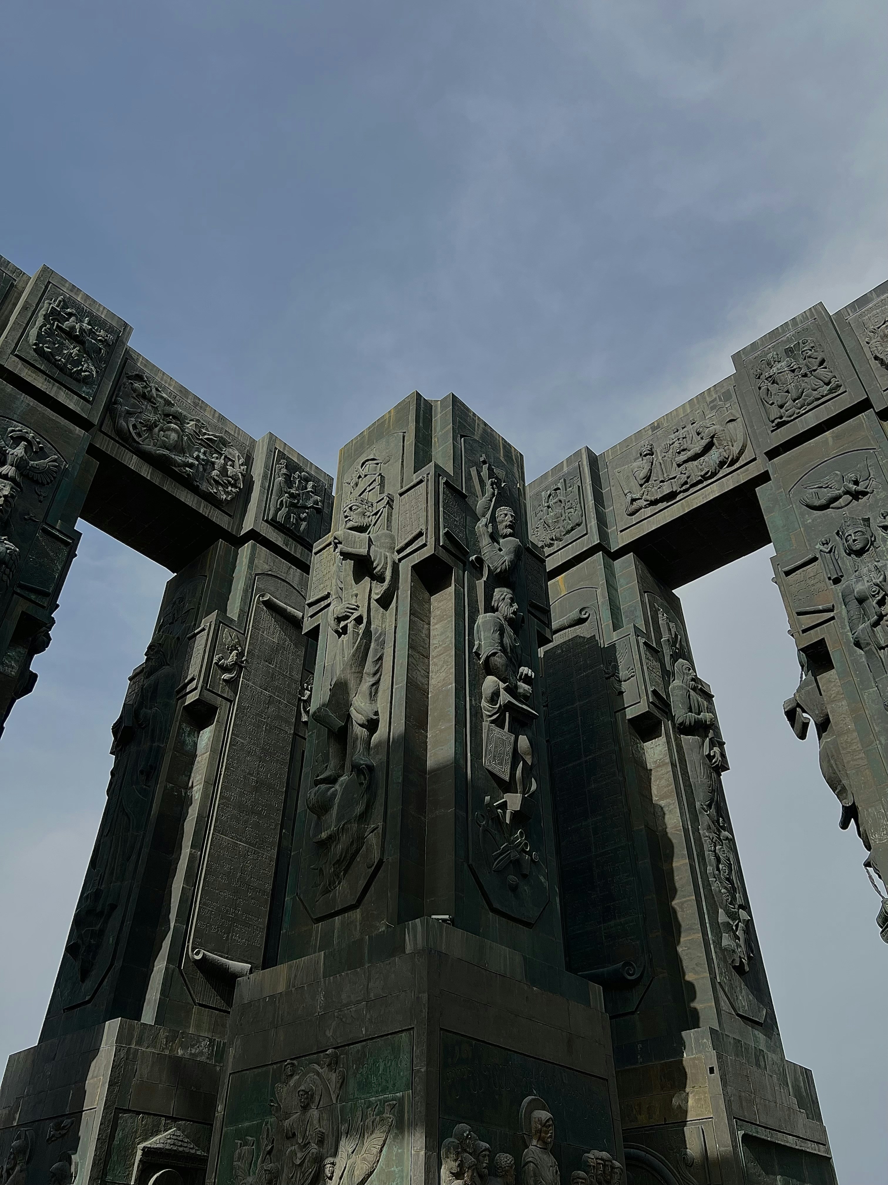A very tall structure with many carvings on it photo – Free Grey Image ...