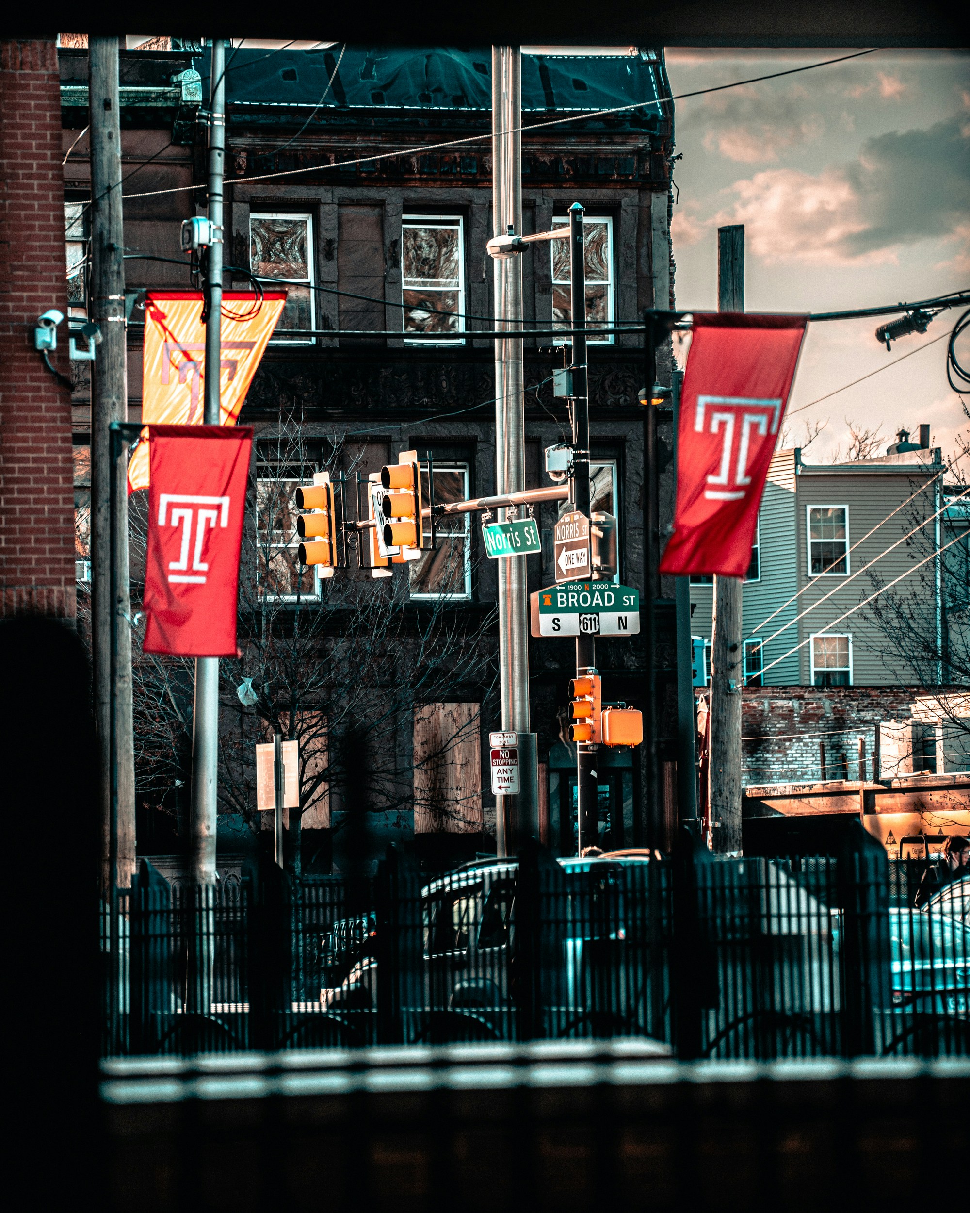 A city street with traffic lights and street signs photo – Free ...