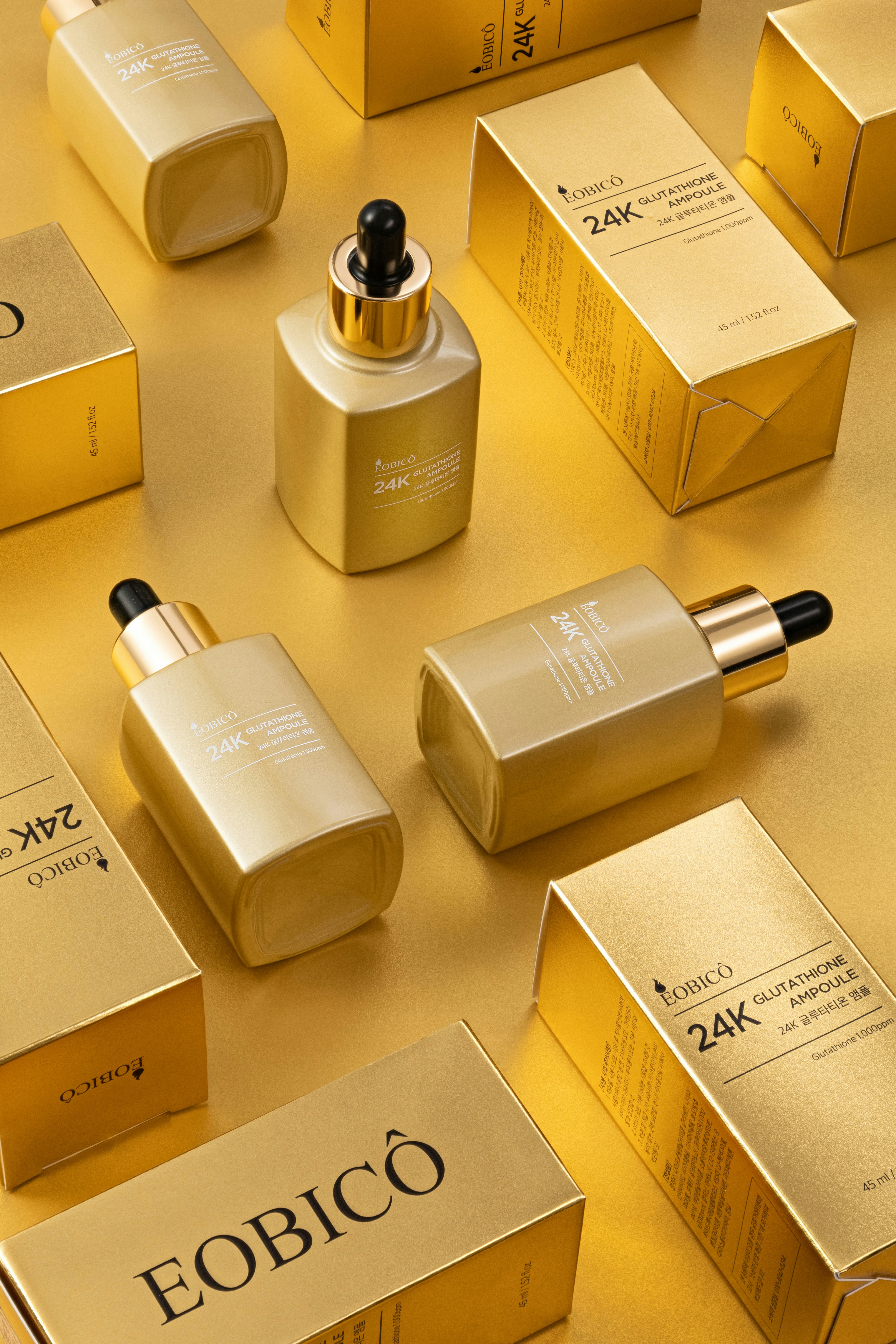 A table topped with gold boxes and bottles of perfume photo – Free ...