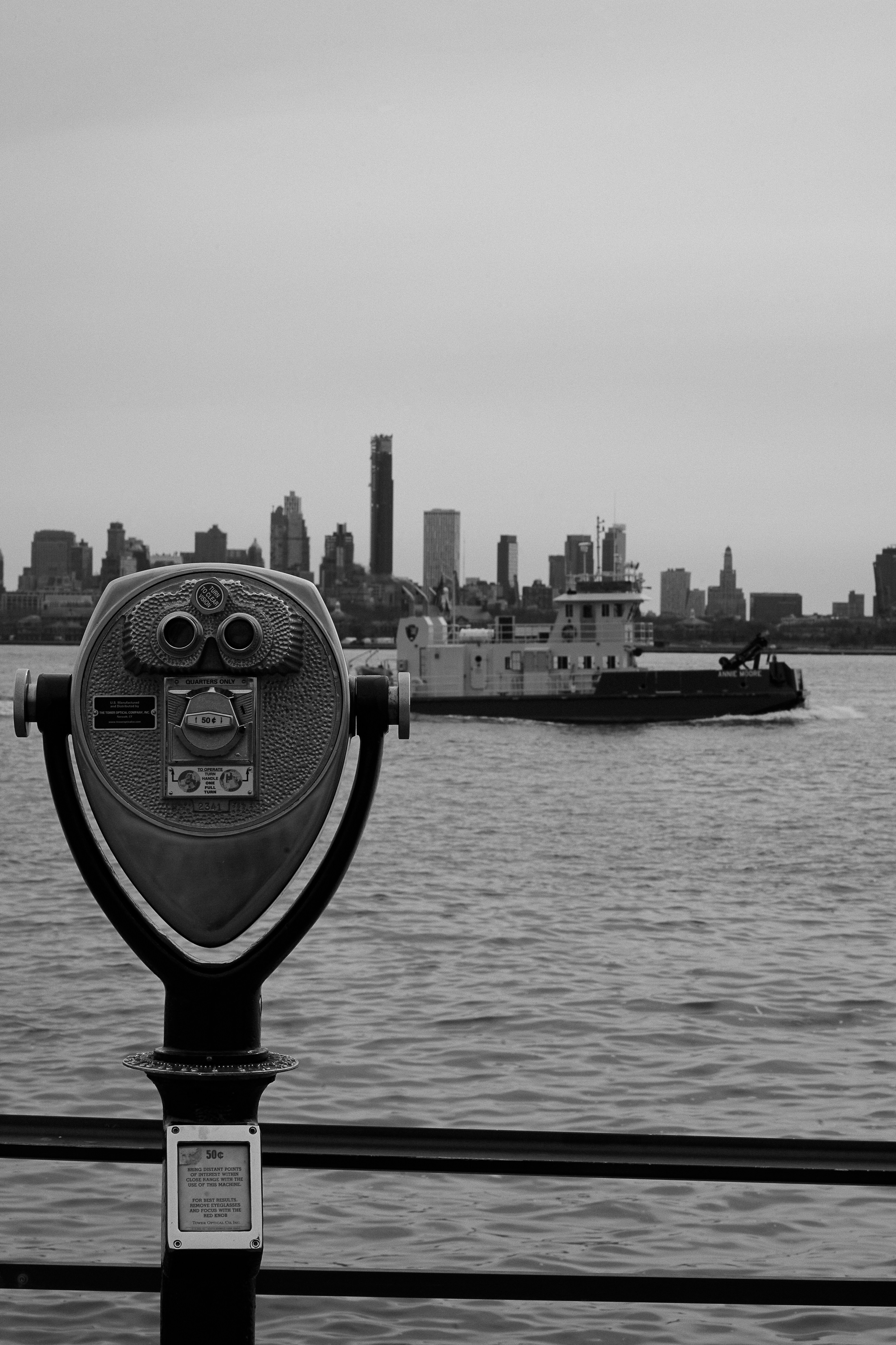 a black and white photo of a boat in the water