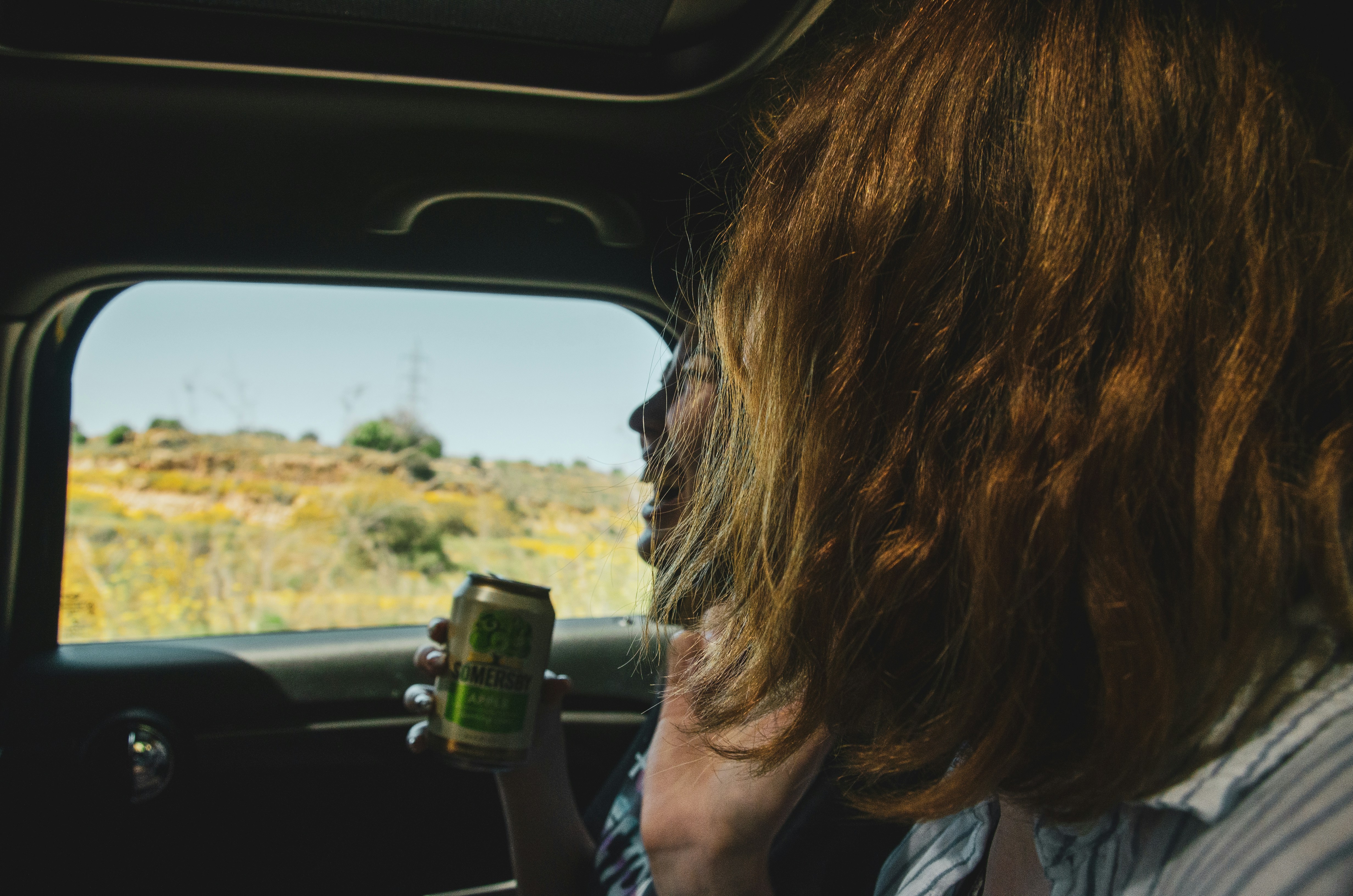 Through the Passenger Window: Quiet Portrait of a Road Trip Moment
