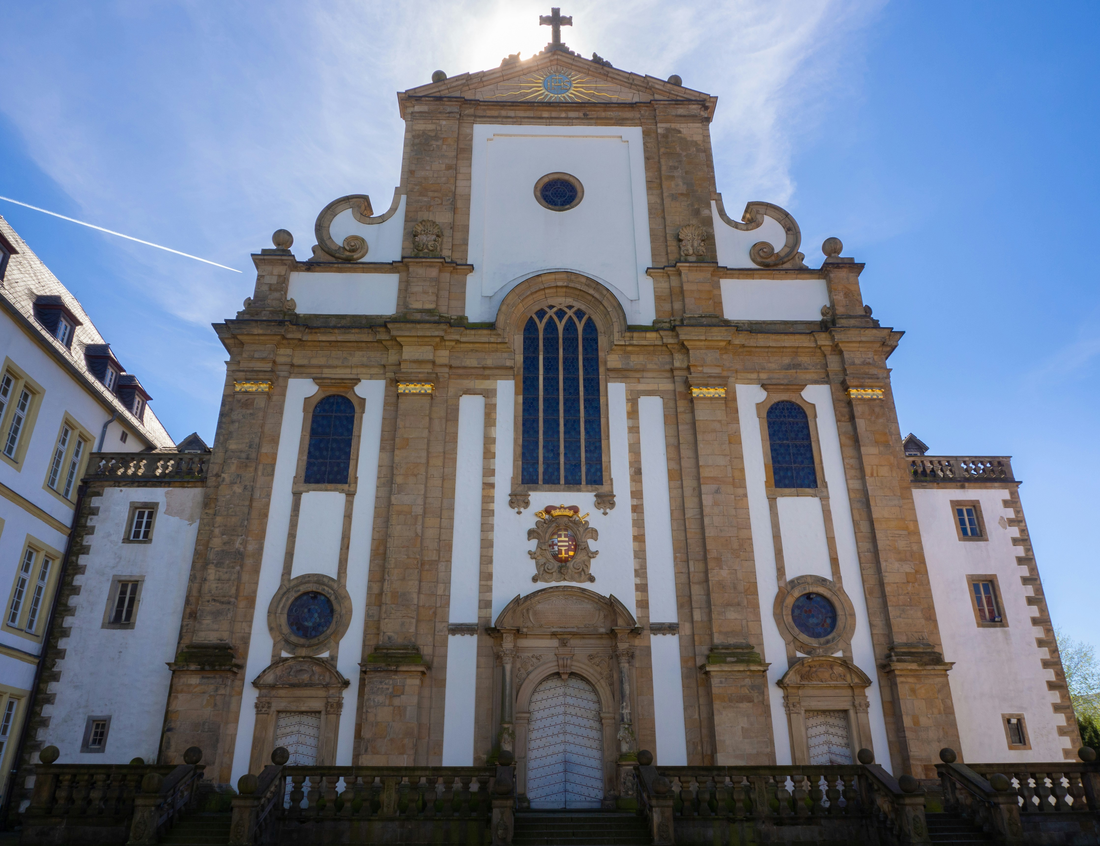A large church with a cross on the front of it photo – Free Paderborn ...