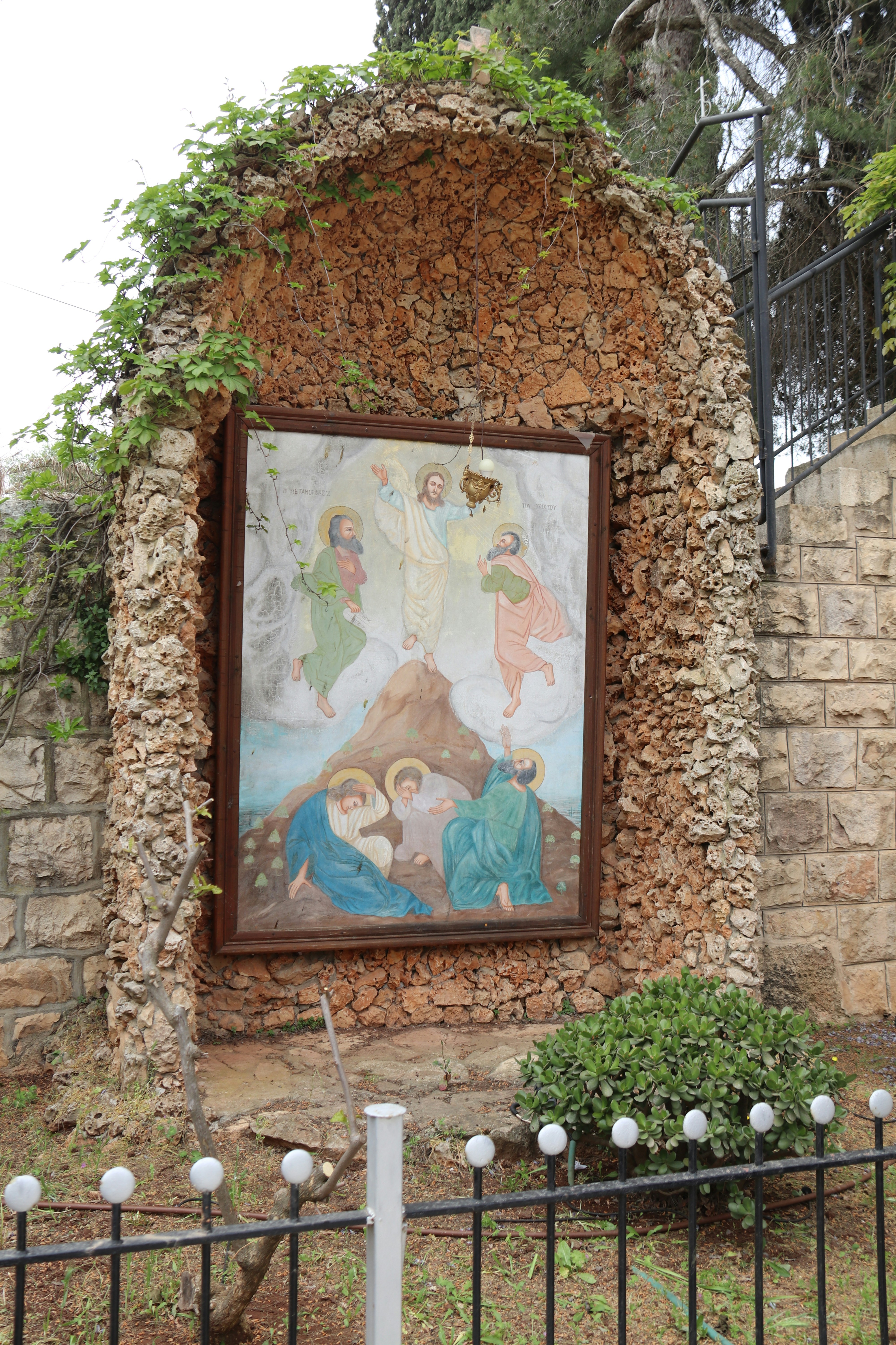 Framed Light in a Crumbling Arch: A Colorful Icon in a Weathered Niche