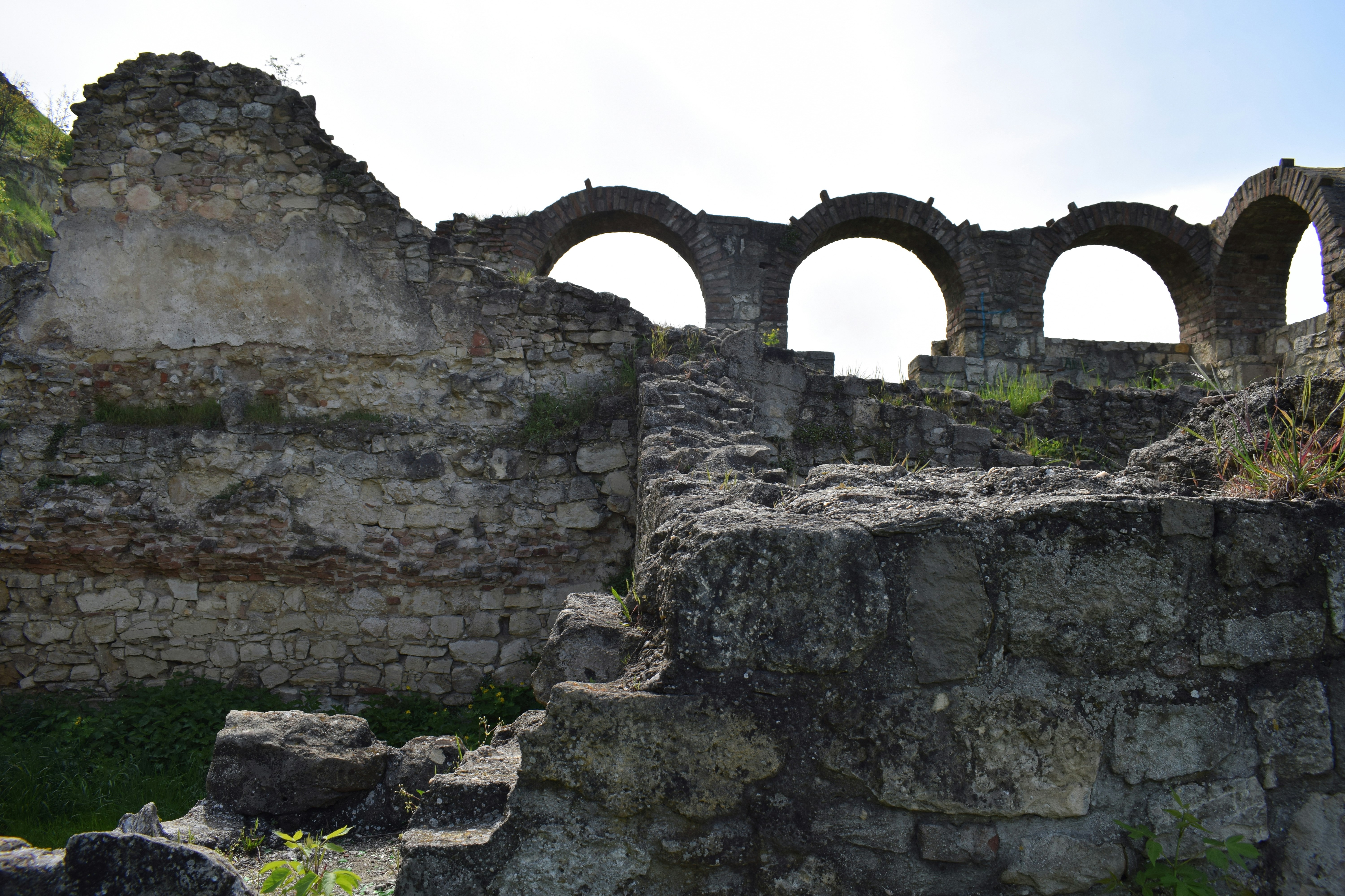 The ruins of a castle with arched windows photo – Free Grey Image on ...