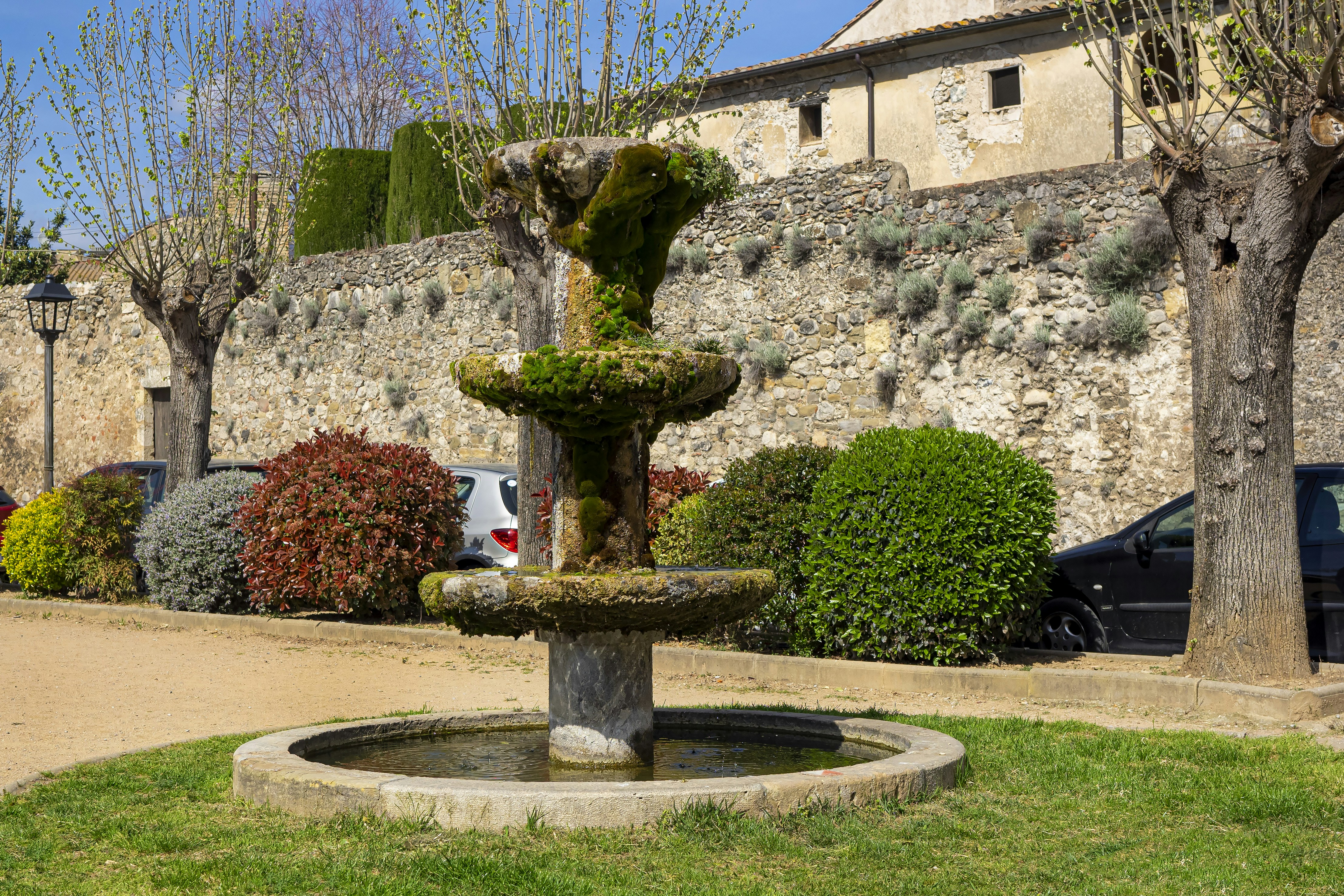 Rustic Fountain Amidst Historic Stonework