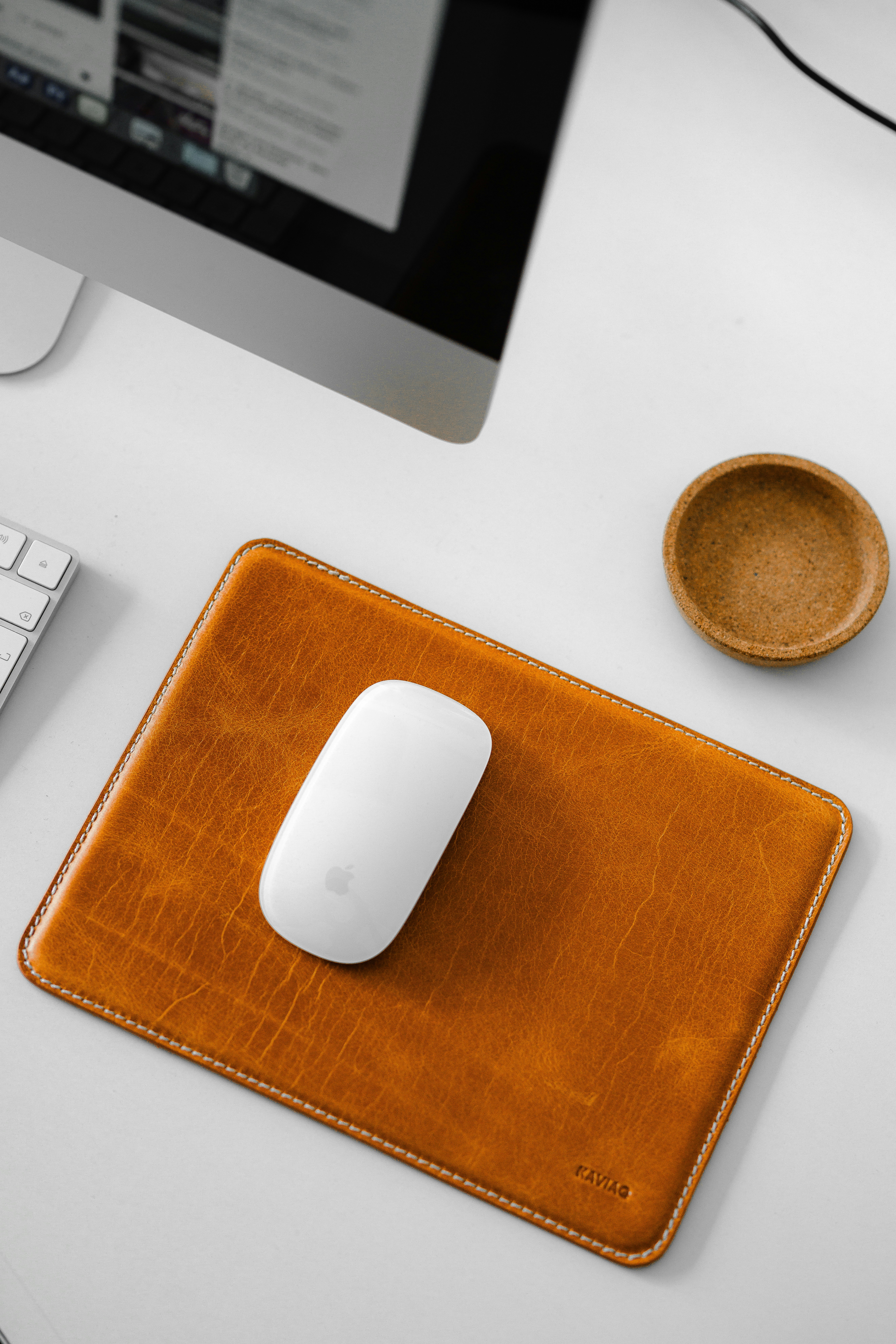 A computer mouse and a leather pad on a desk photo – Free Brown Image ...