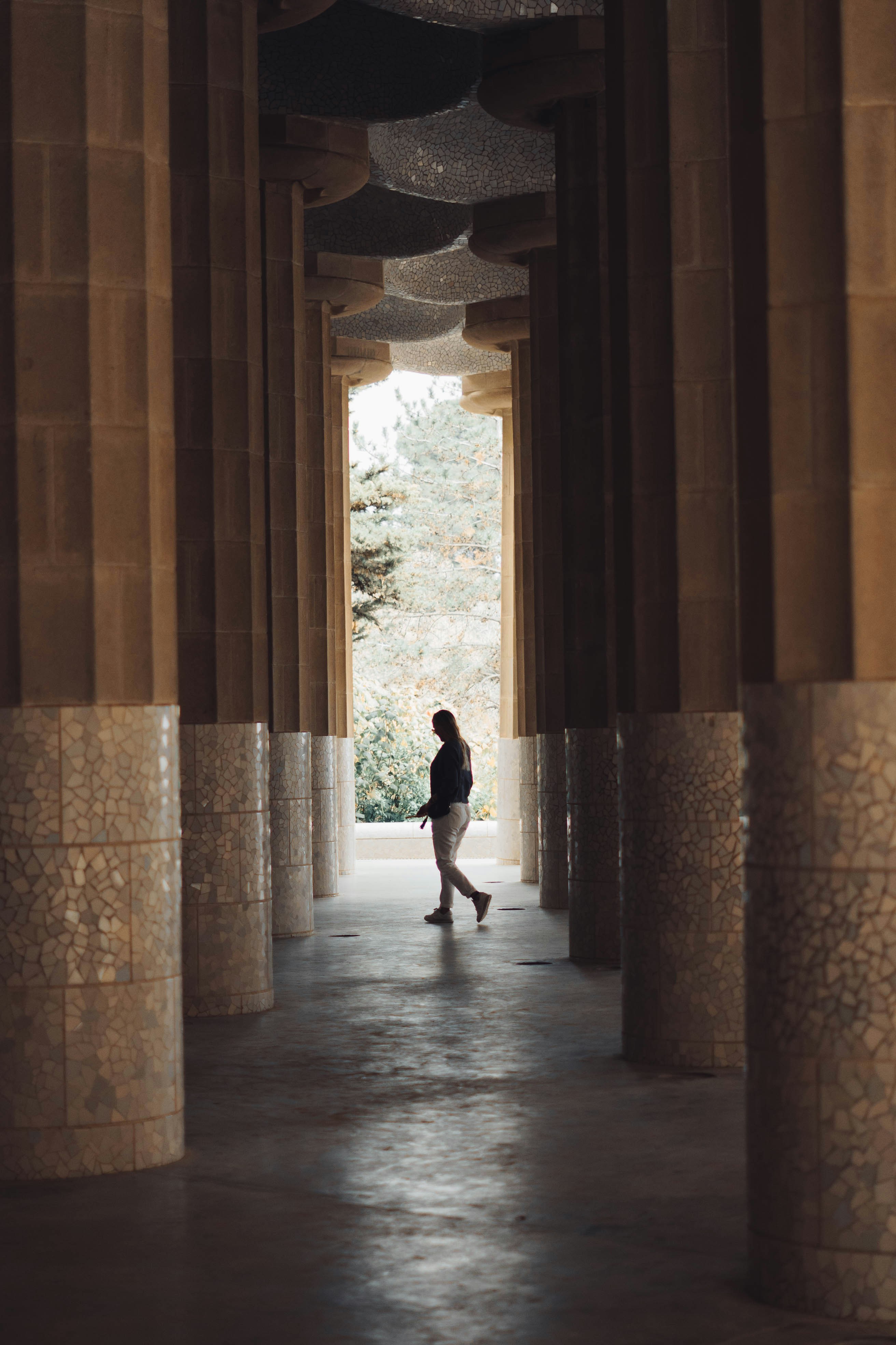 A person walking through a building photo – Free Architecture Image on ...