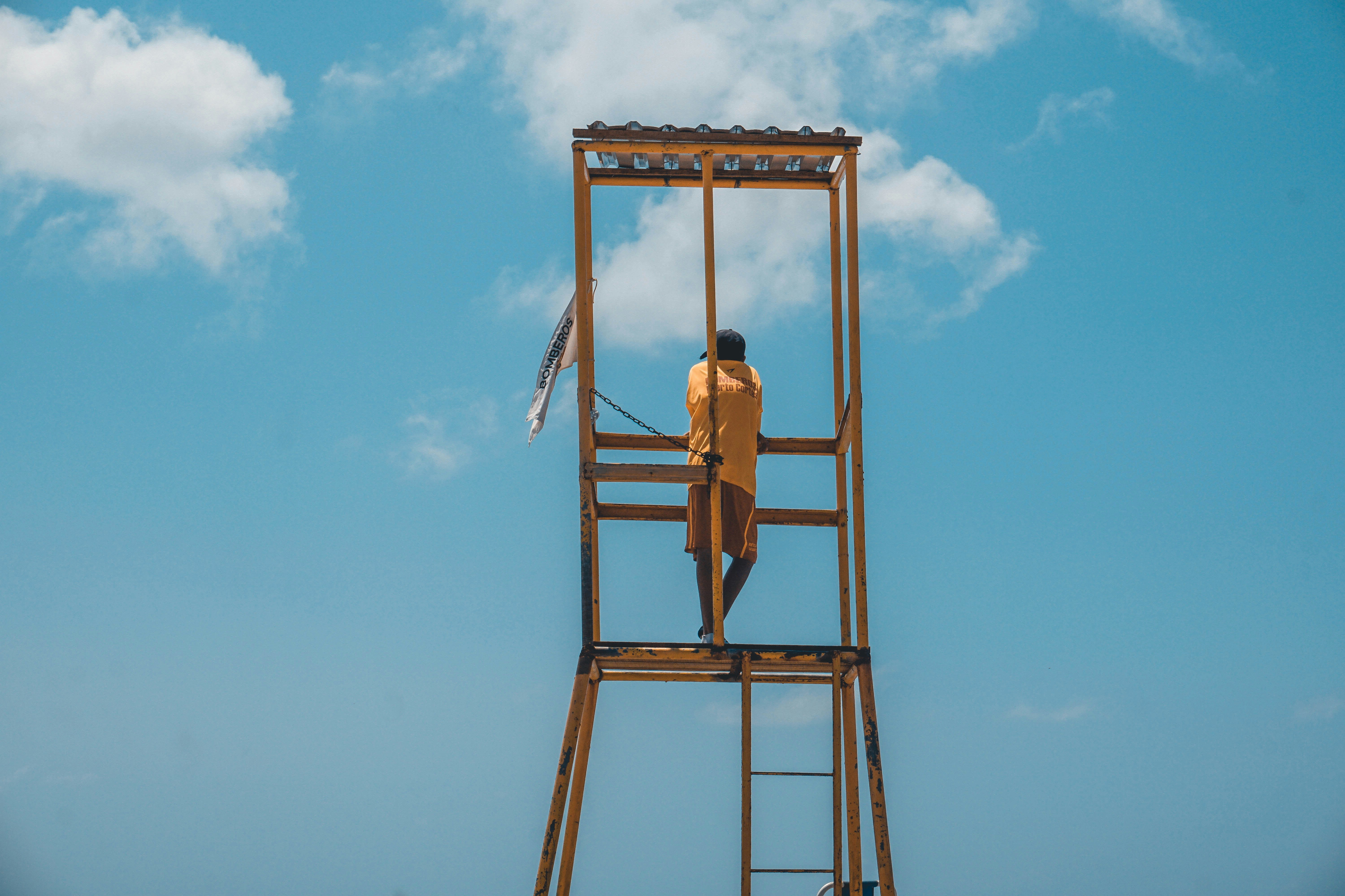 Lifeguard Tower Silhouette Against a Clear Sea-Blue Sky
