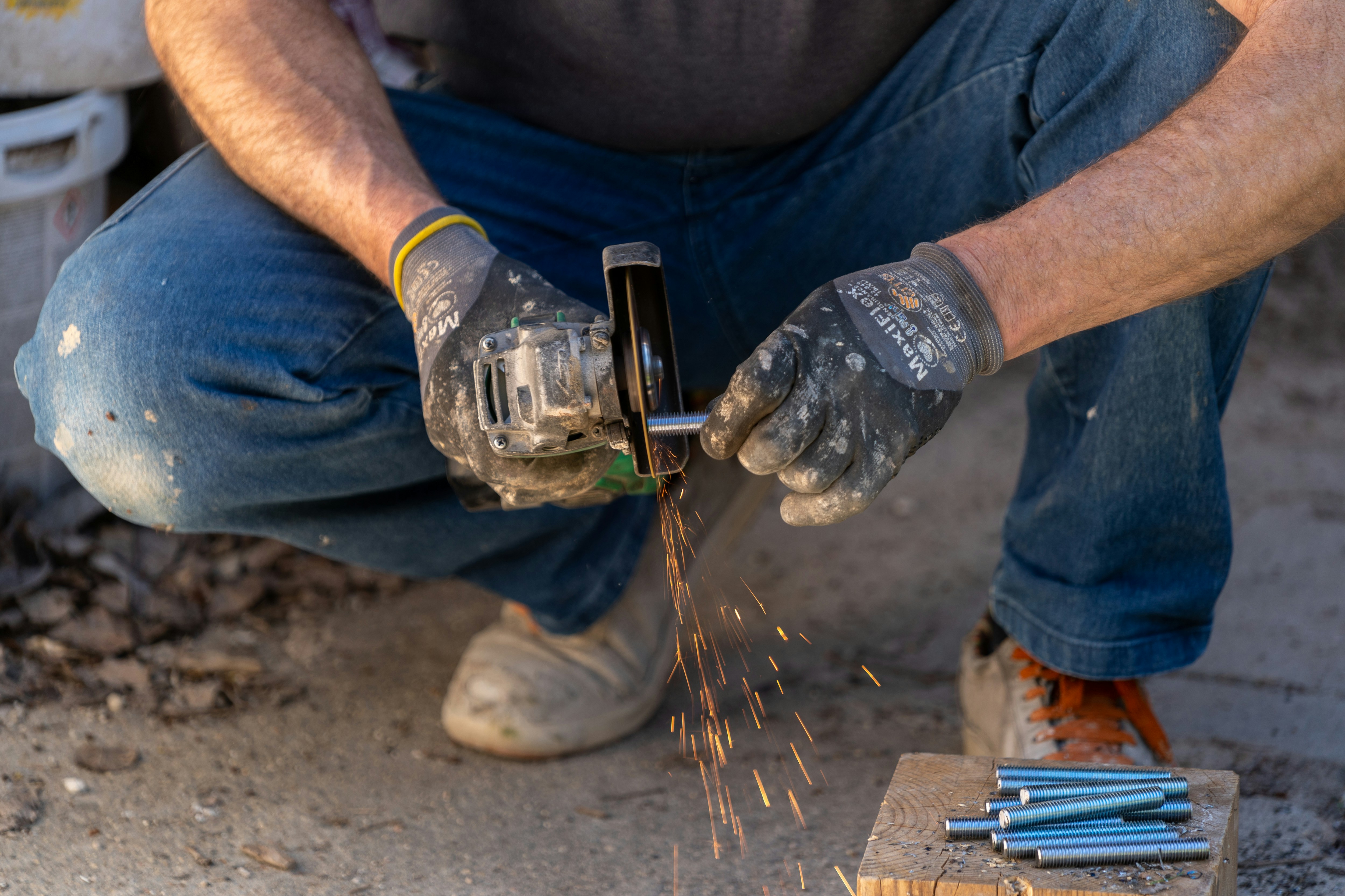 A man holding a pipe photo – Free Work Image on Unsplash