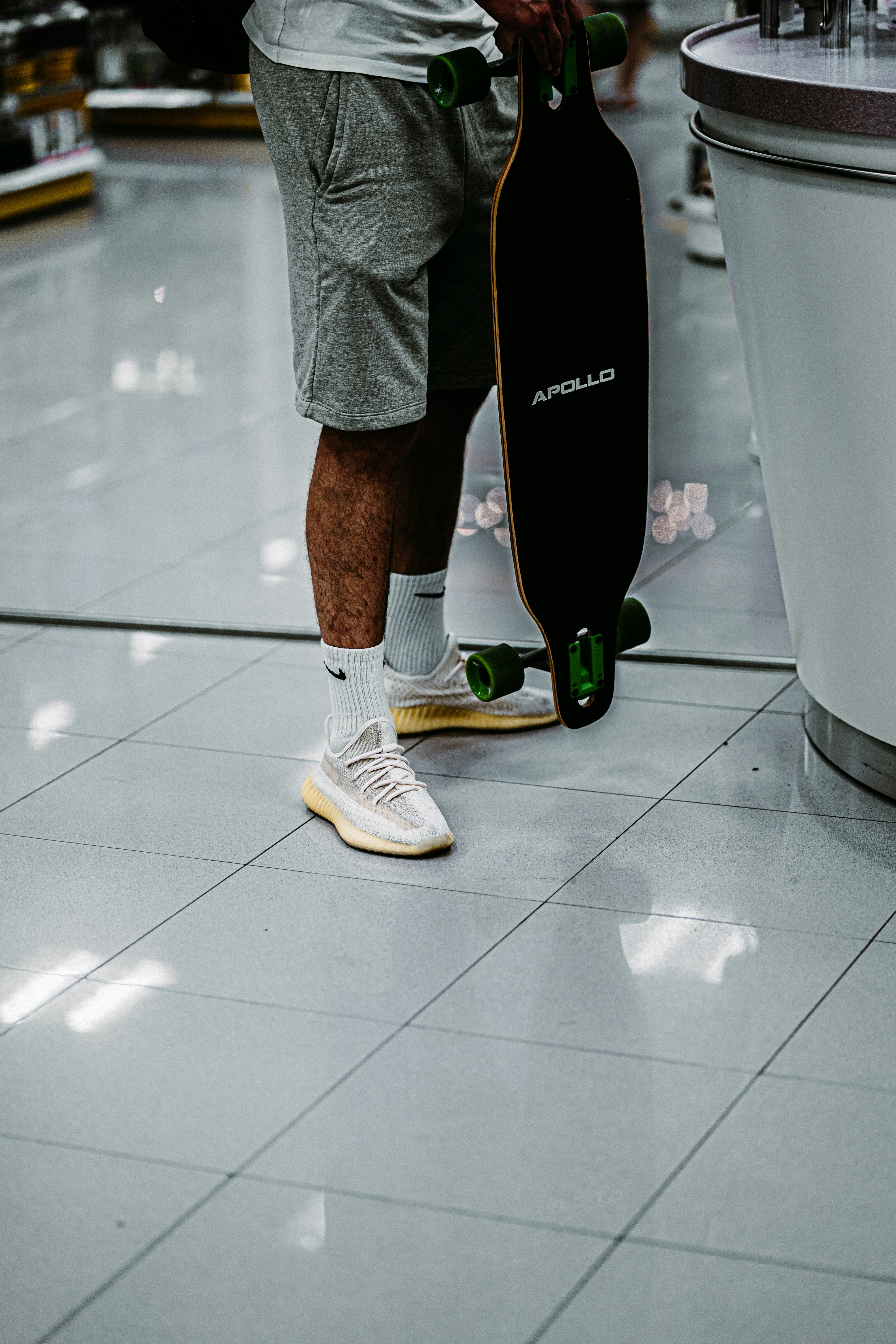 Apollo Longboard in the Aisle: Urban Minimalism on Glossy Tiles