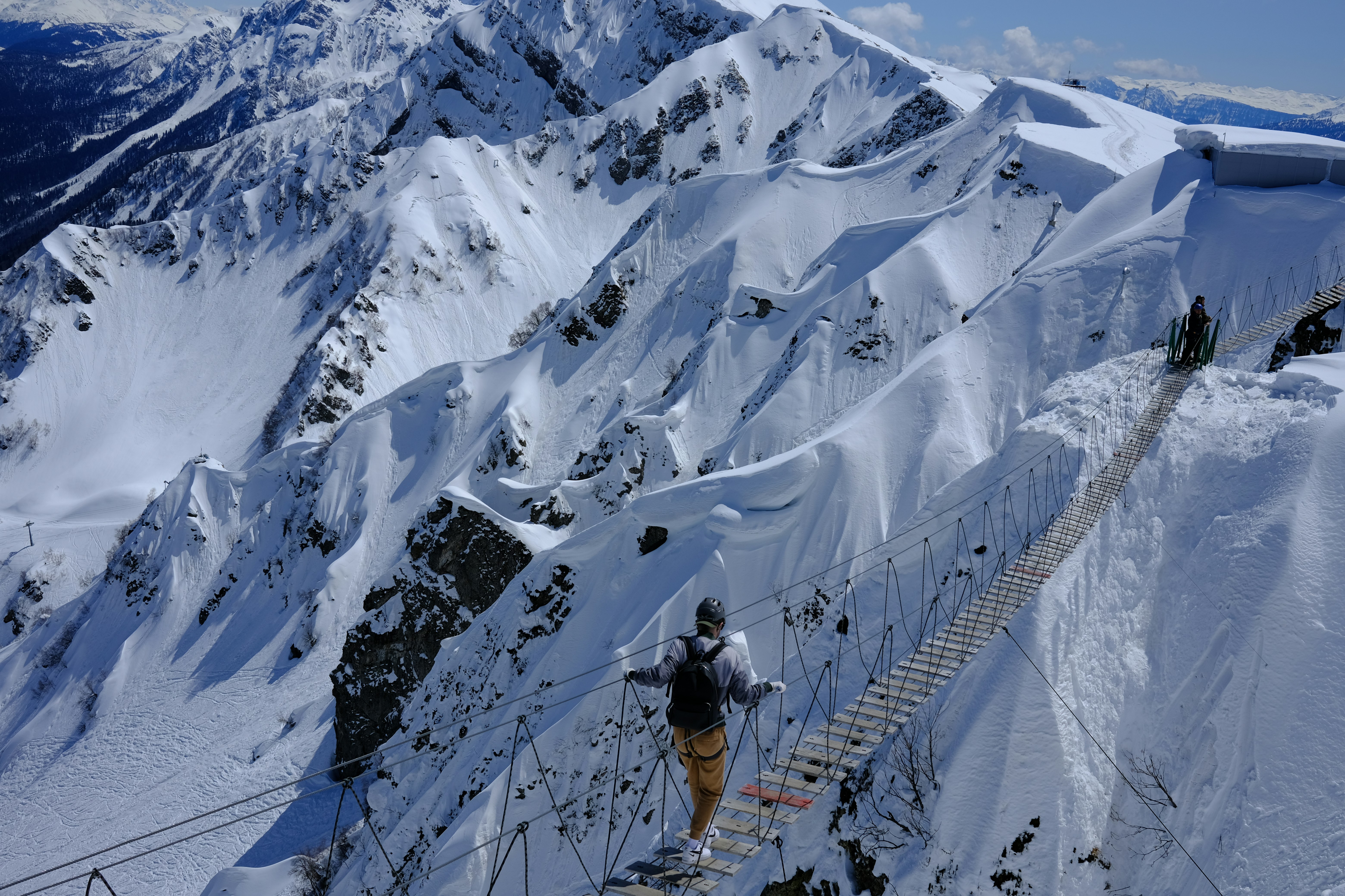 Precarious Pathway Amidst Snowy Peaks
