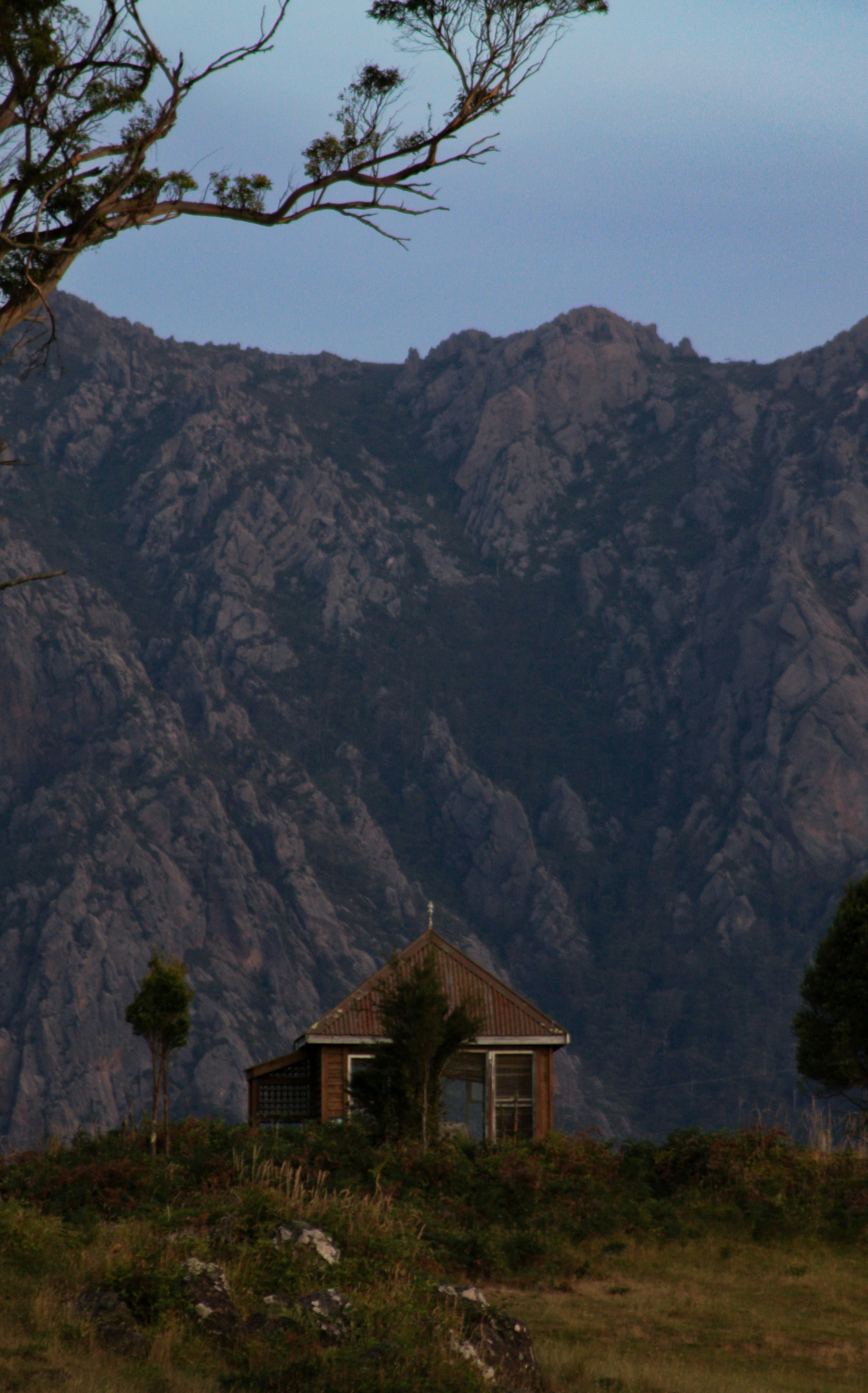 Whispers of Solitude: A Cabin Amidst the Peaks