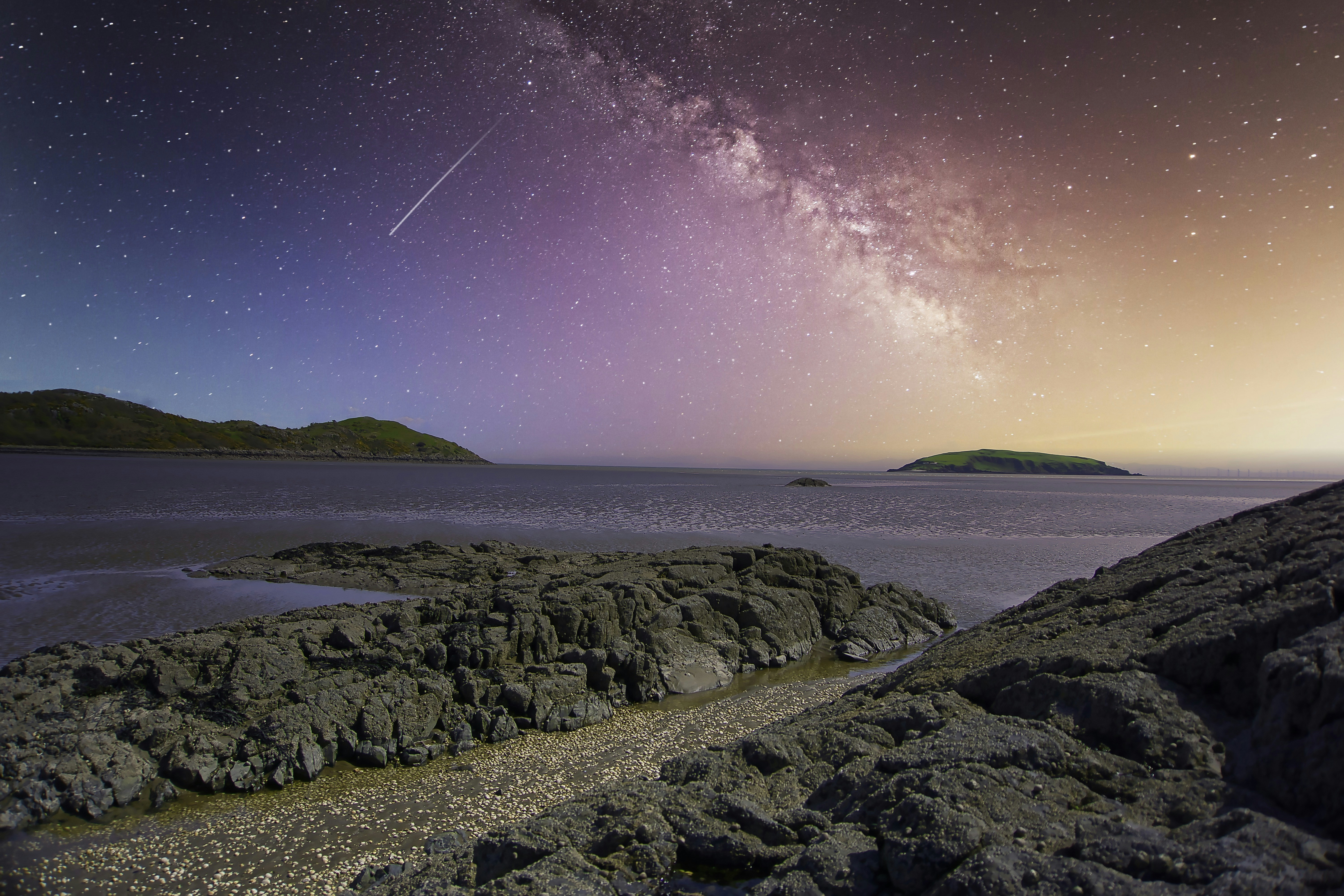 Milky Way Meets the Coast: A Shooting Star Over Jagged Rocks