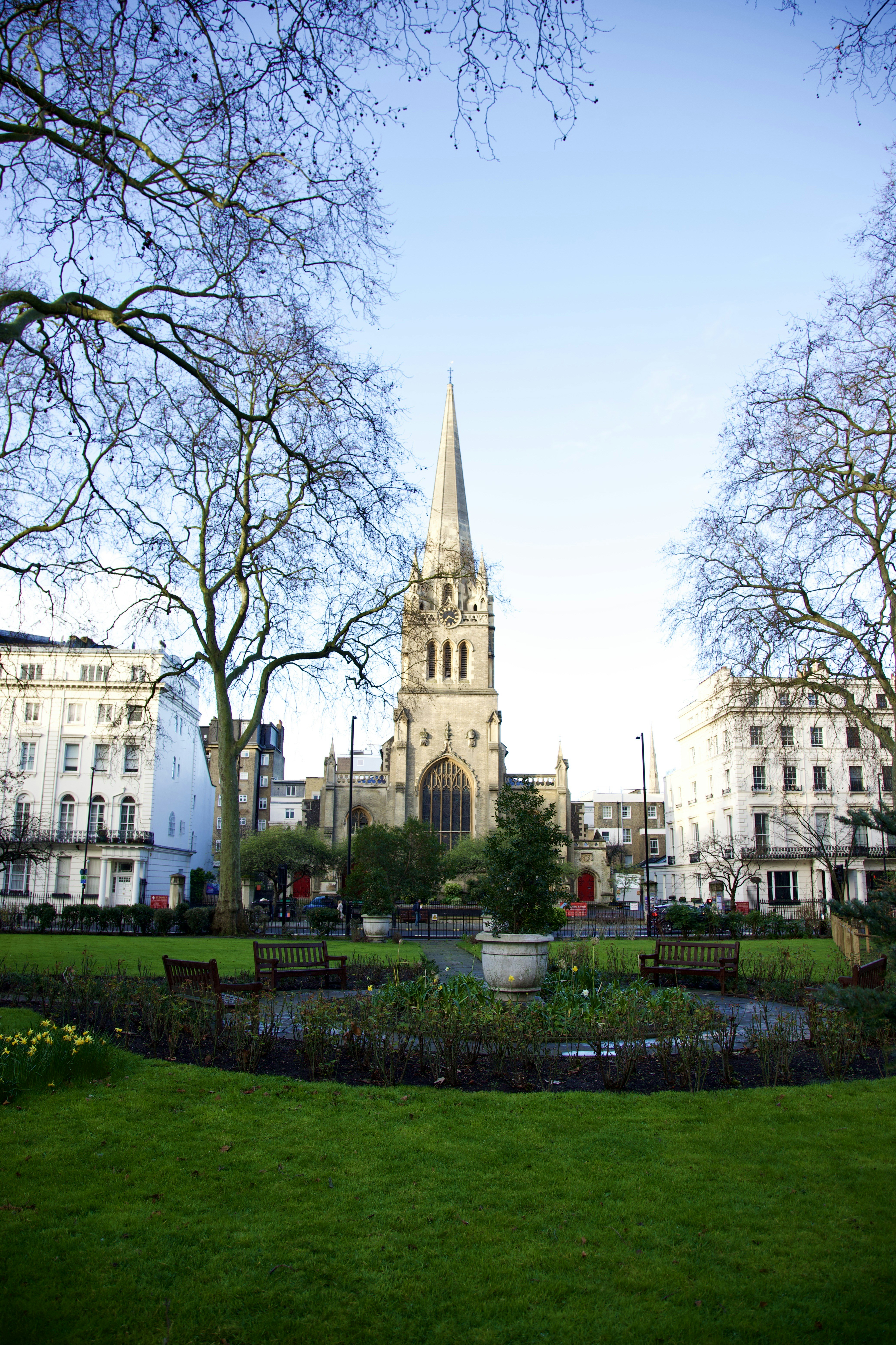 Spire Over the Park: A Georgian Town Square Framed by Winter Trees