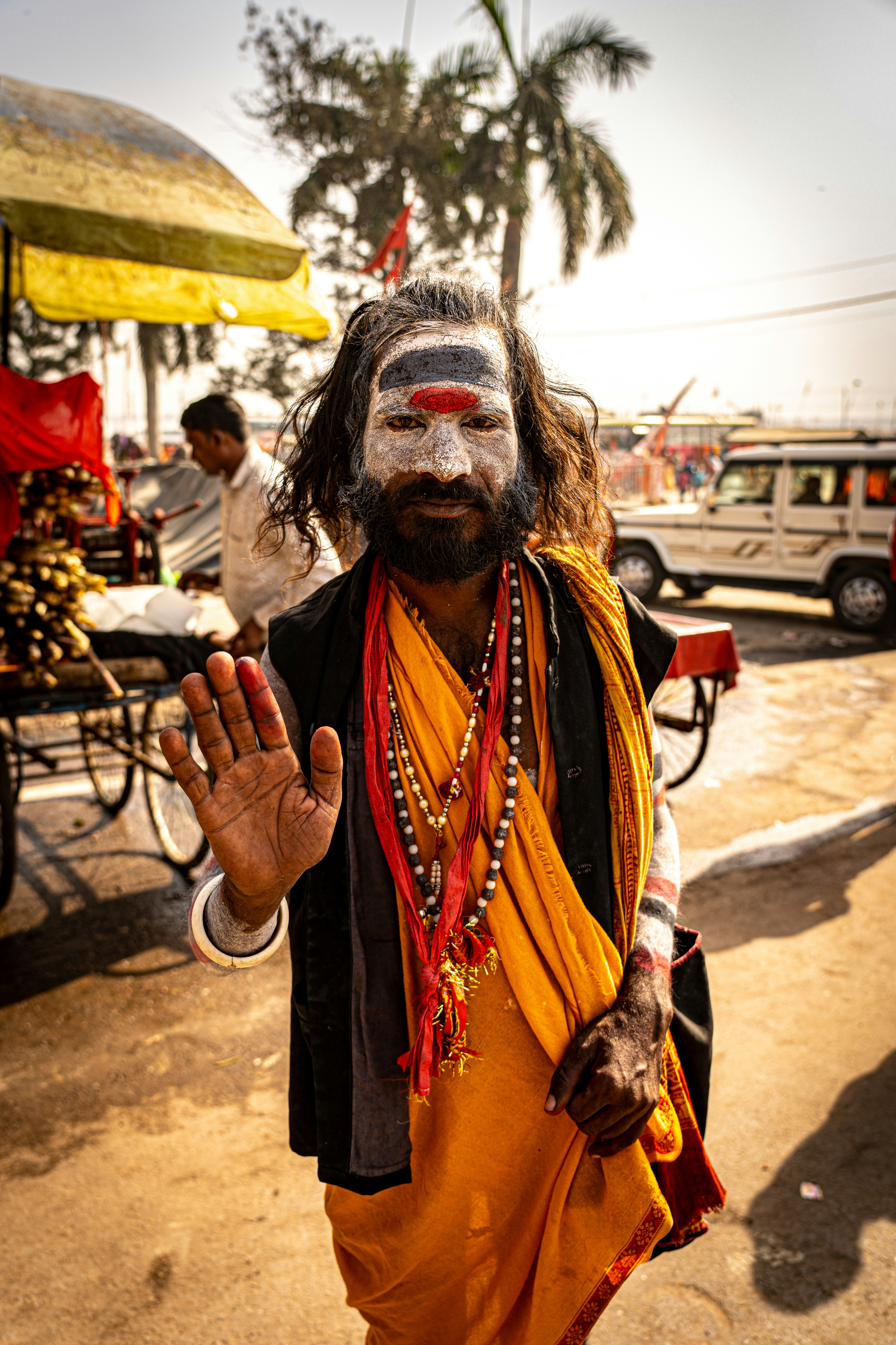 Priestly Gesture at a Busy Market Portal