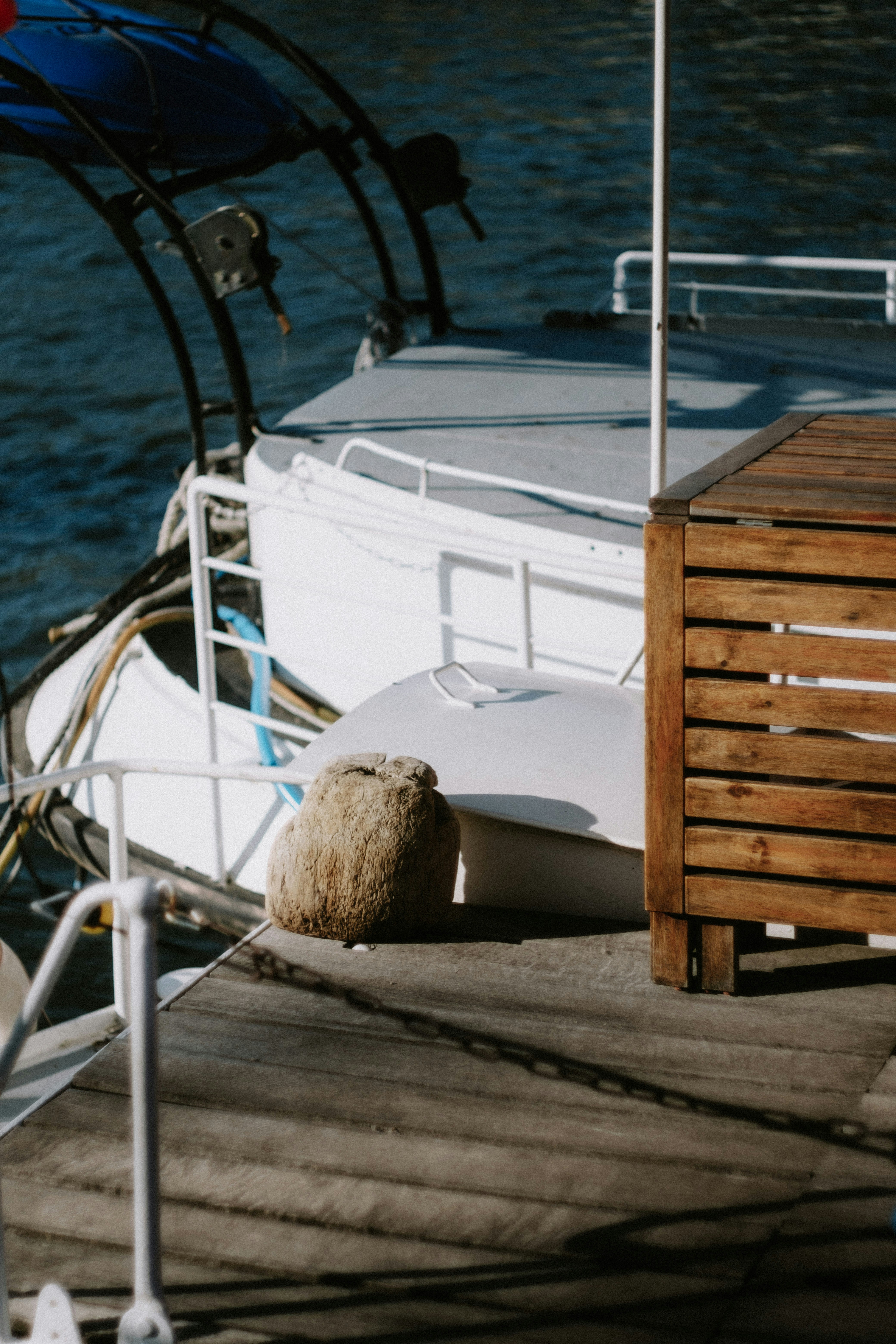 Rock as Anchor on a Dockside Tableau with Boat and Wood
