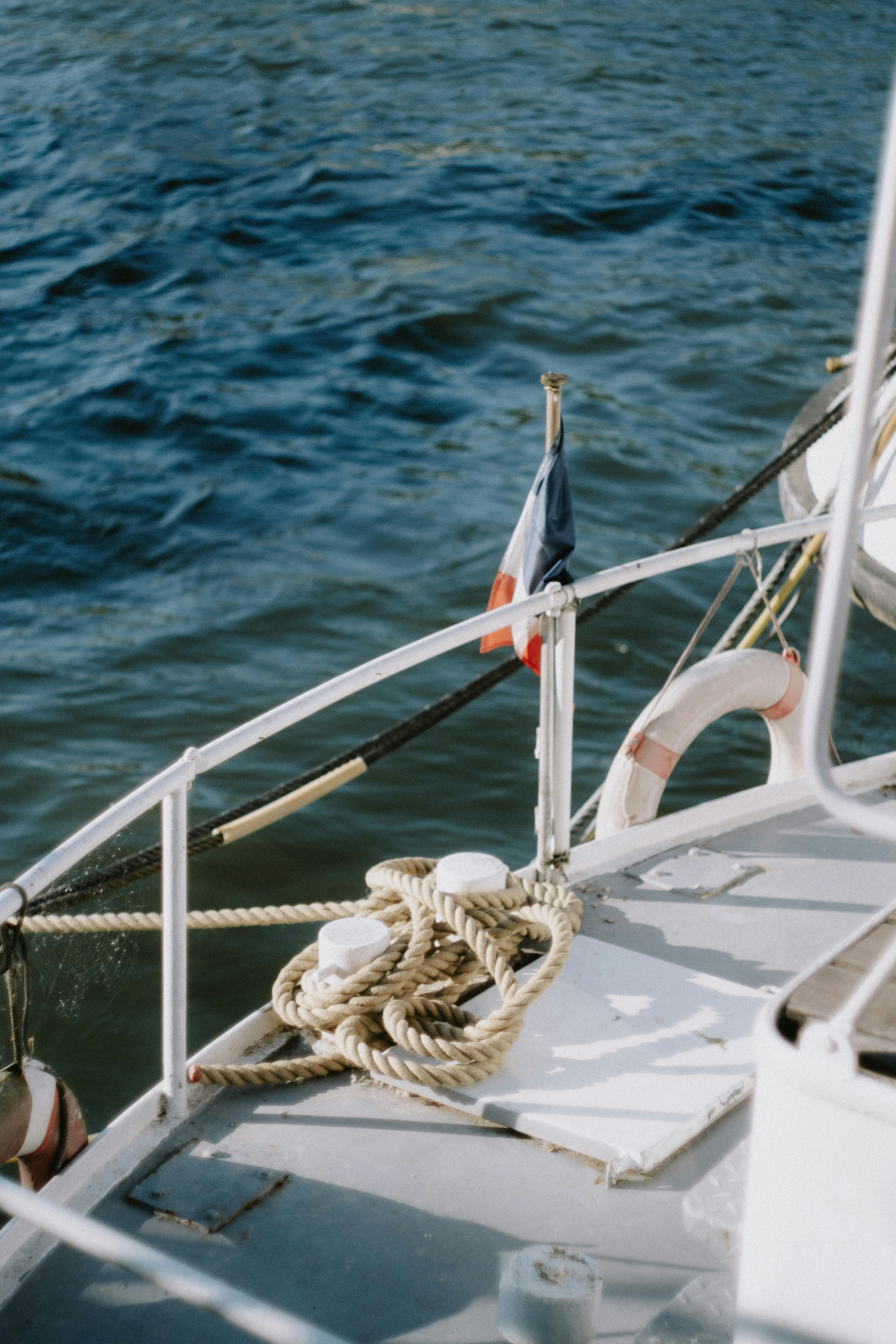 Knotwork and Sea: A Quiet Moment on a Sailing Deck