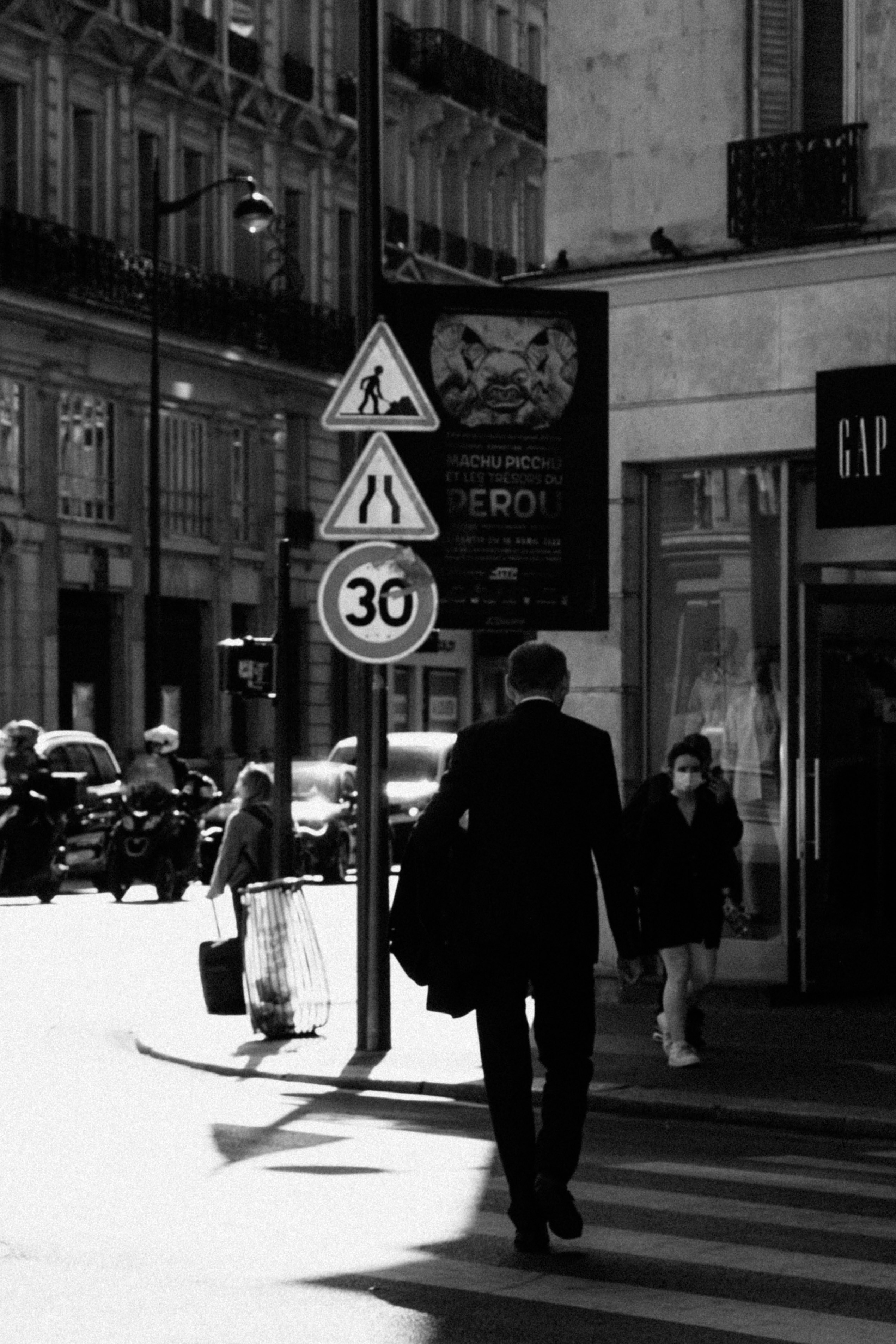 a person walking down a sidewalk