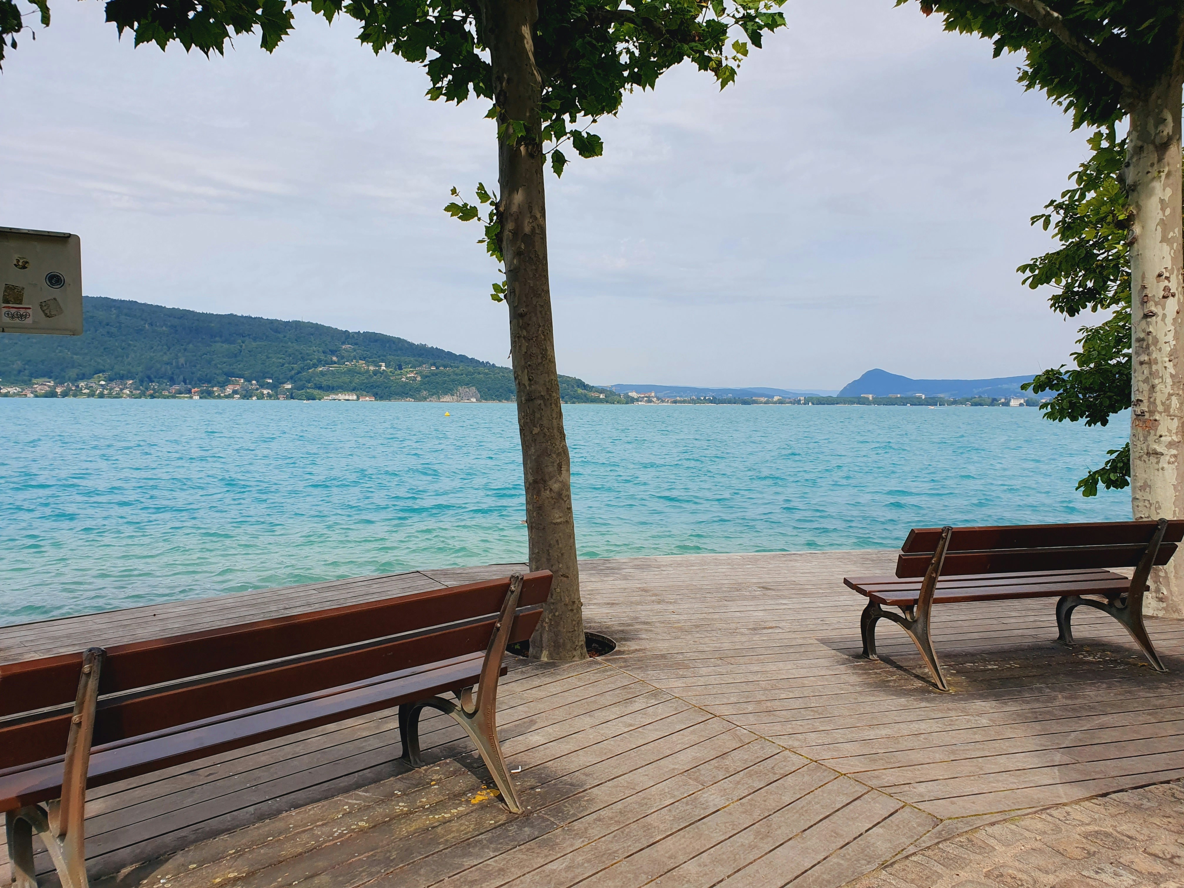 Benches on a deck overlooking a body of water photo – Free France Image ...