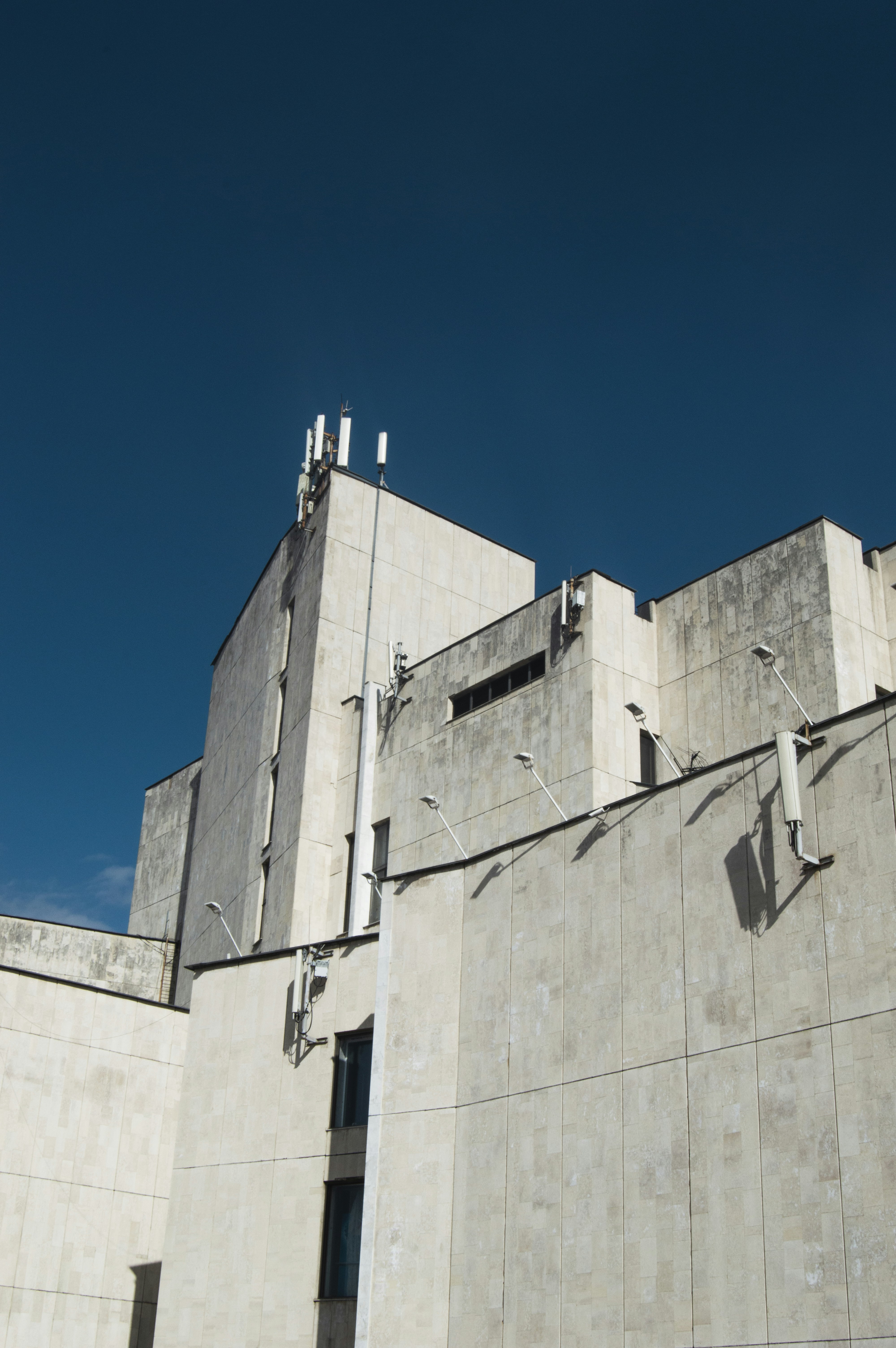 Antenna Crown Over a Brutalist Concrete Facade