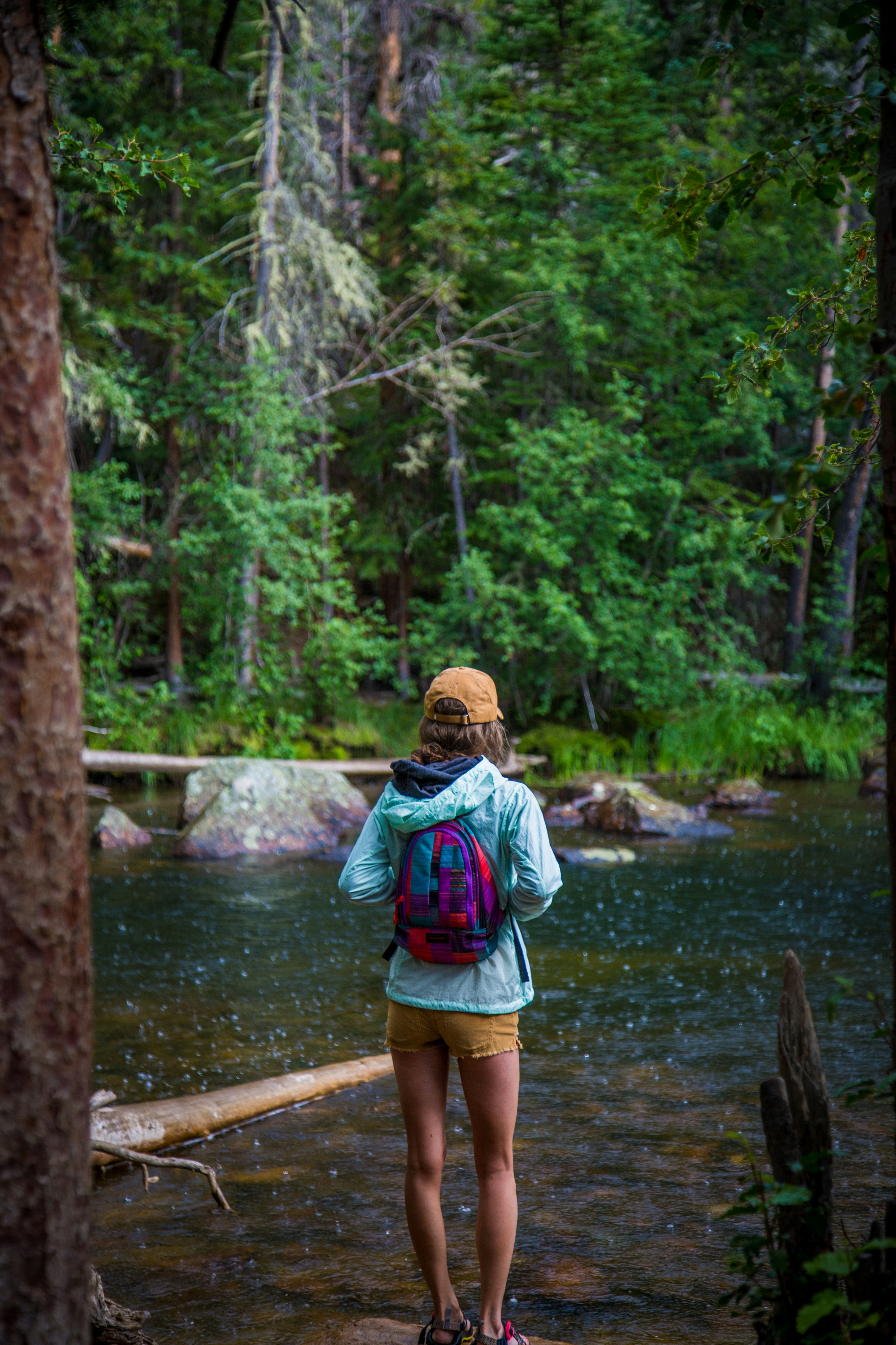 Backpacker by the Forest River: Pause Among Pines