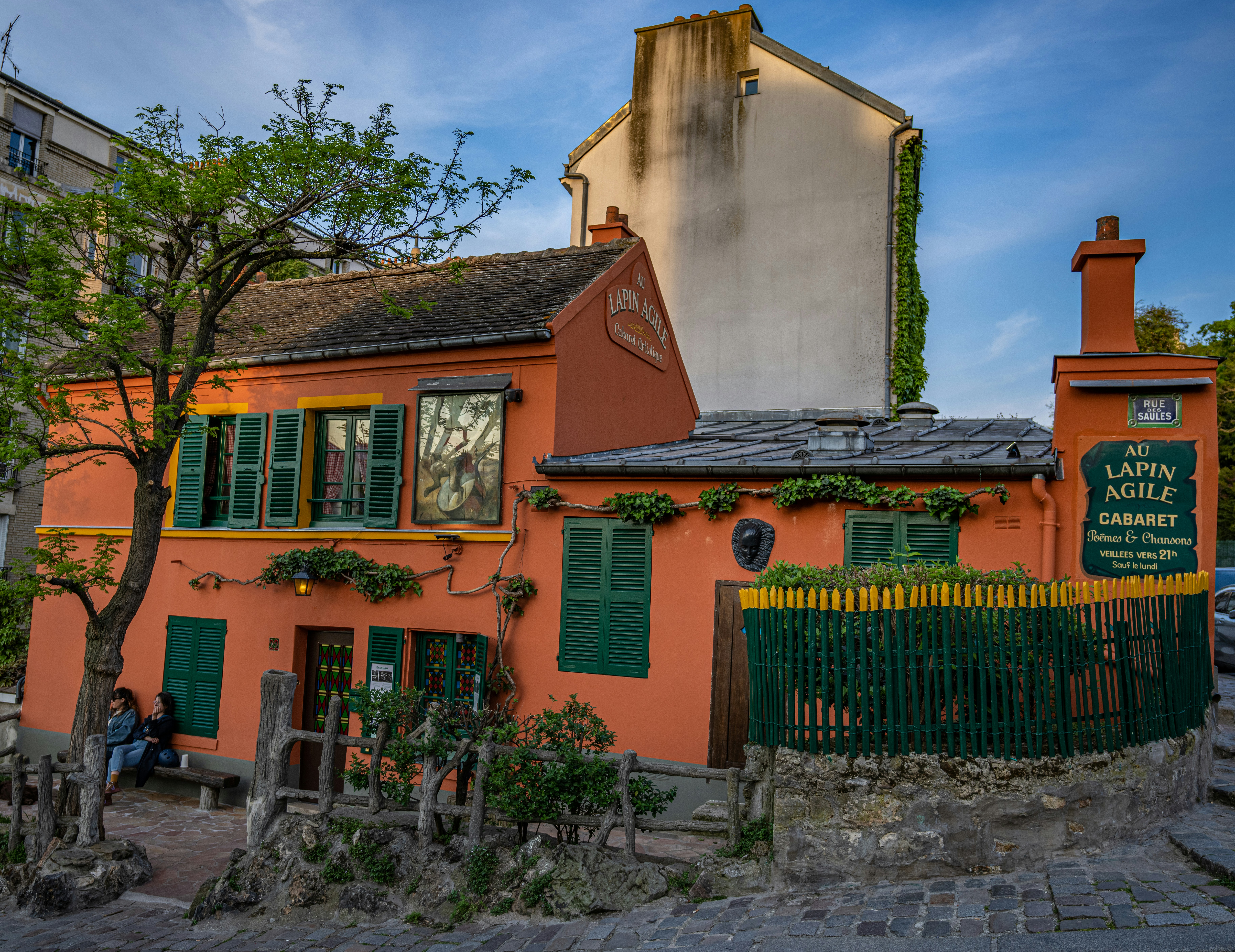 Sunlit Taverna on a Cobblestone Corner