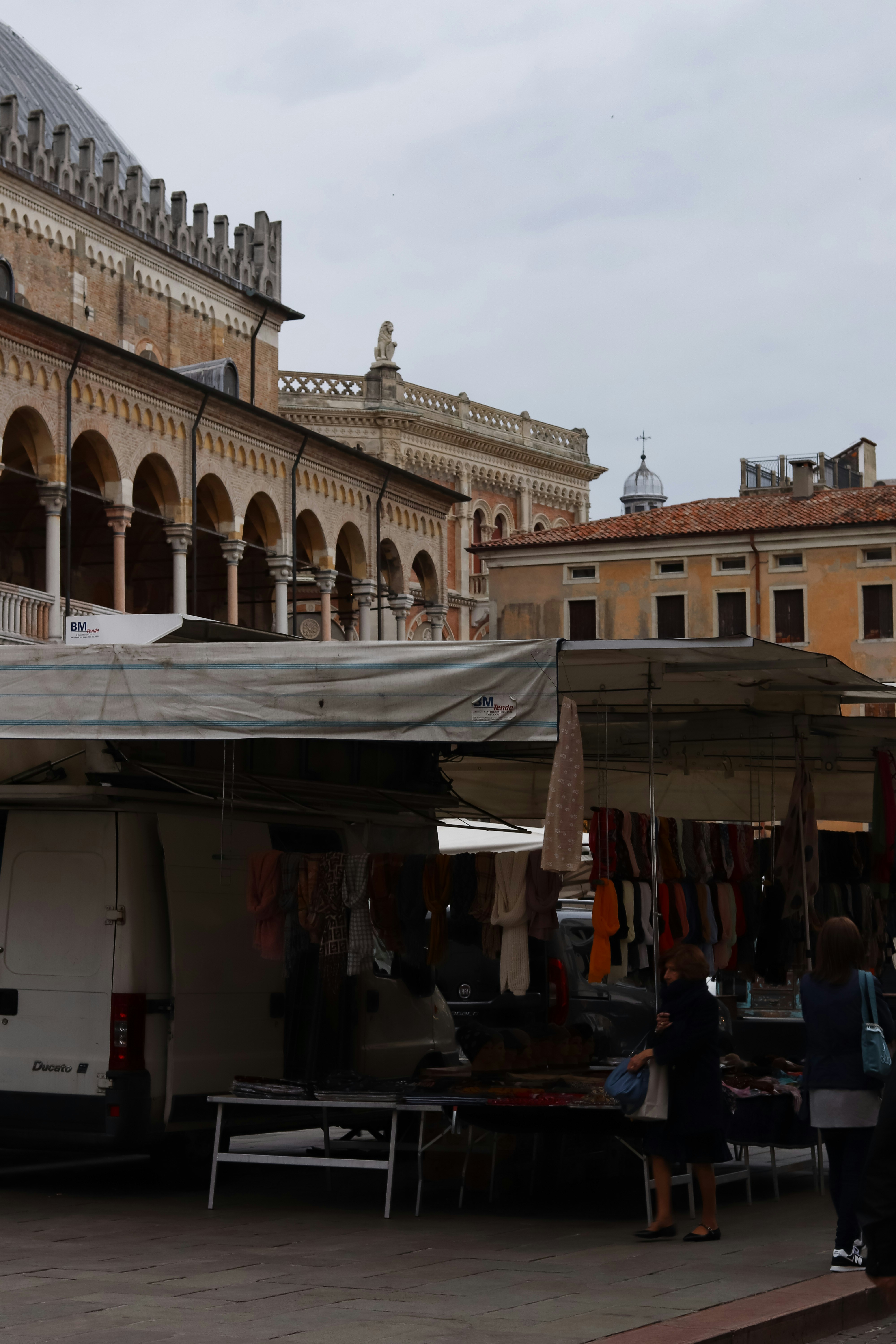 A group of people standing outside a building photo – Free Urban Image ...