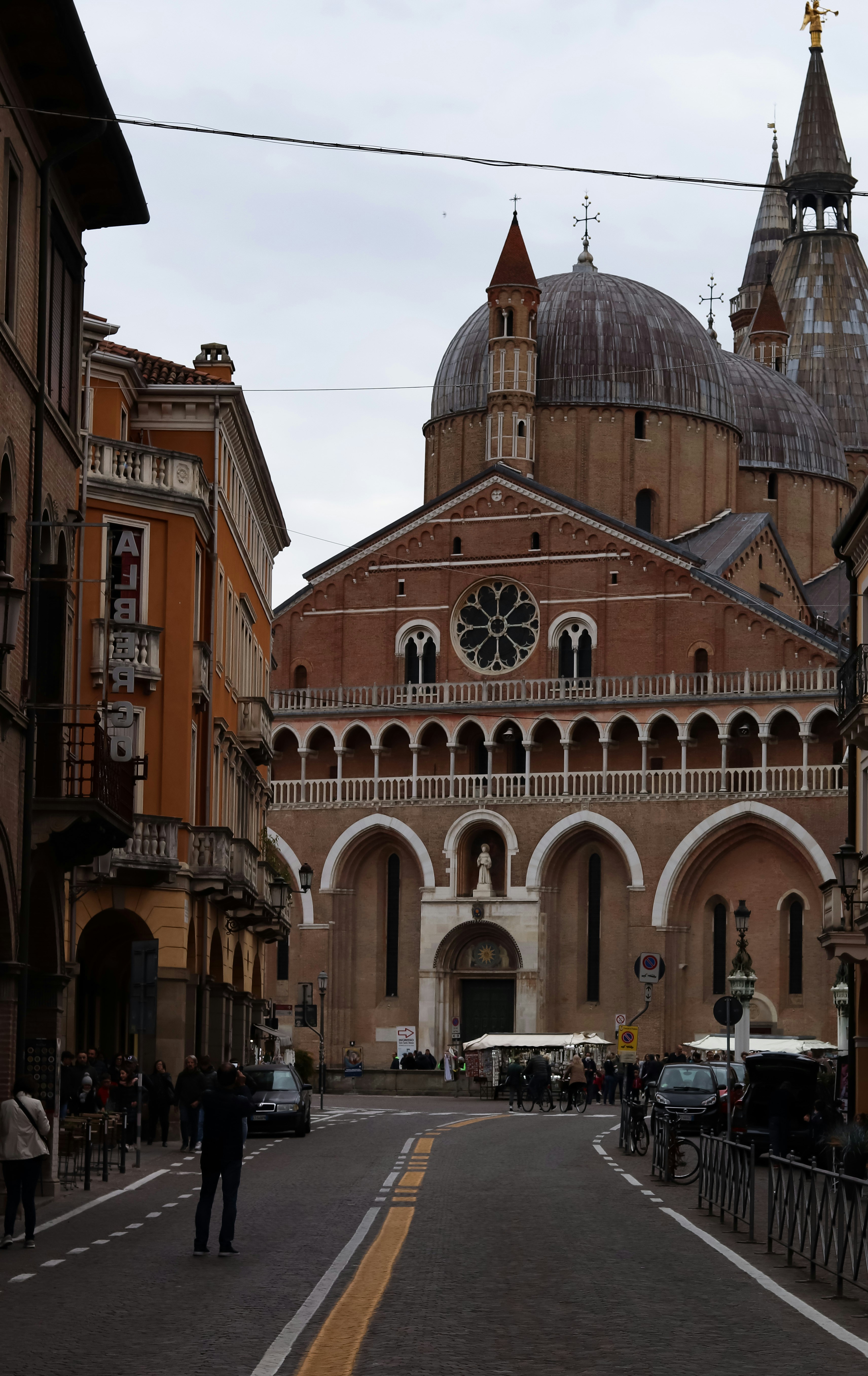 Brick Basilica with a Central Rose Window, Framed by a Busy Street