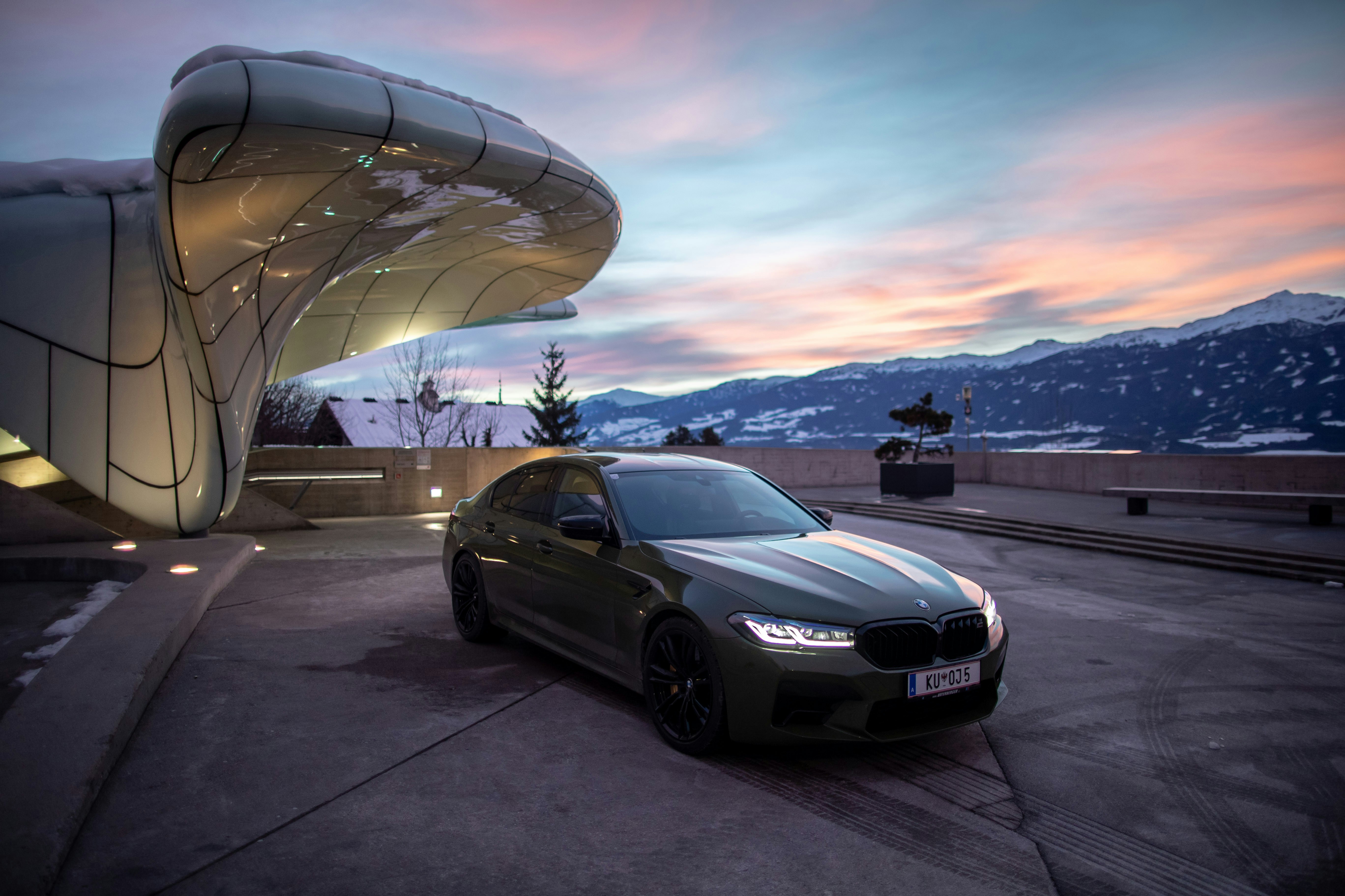 BMW at Dusk: Concrete Canopy and Alpine Sunset