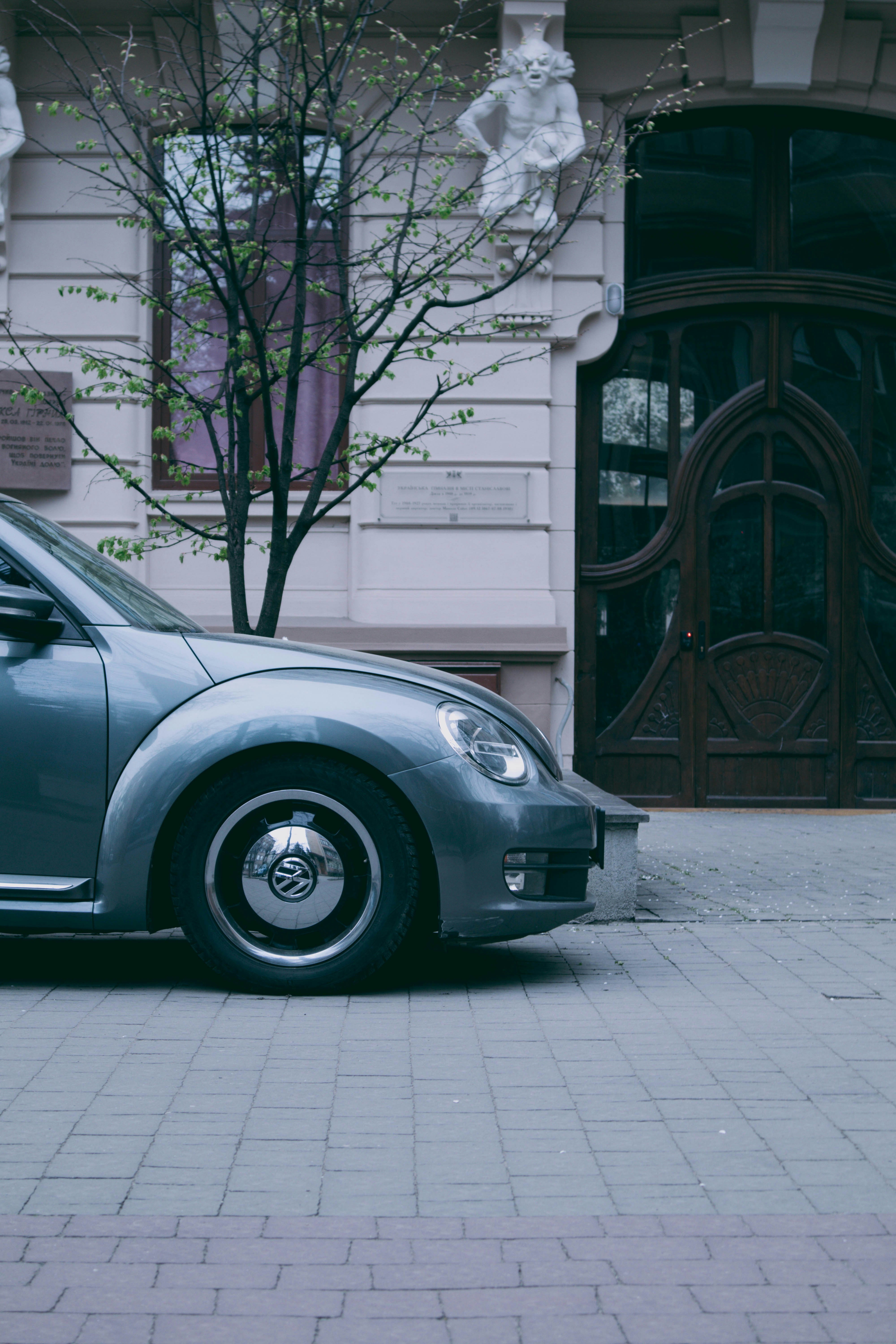 The Quiet Street: A Vintage Car Framed by Architectural Detail