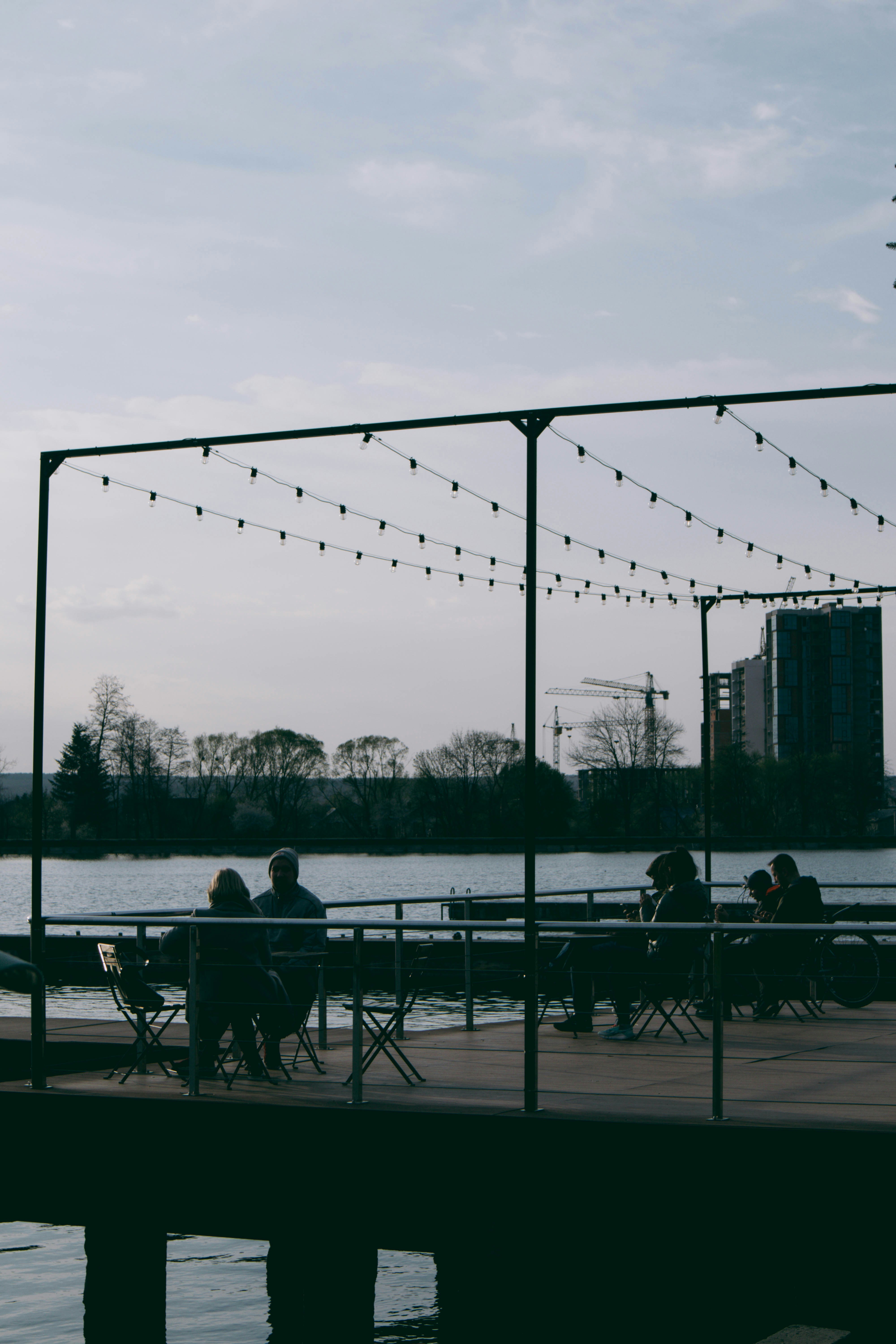 Riverside Pier Under String Lights: Quiet Dinners by the Water