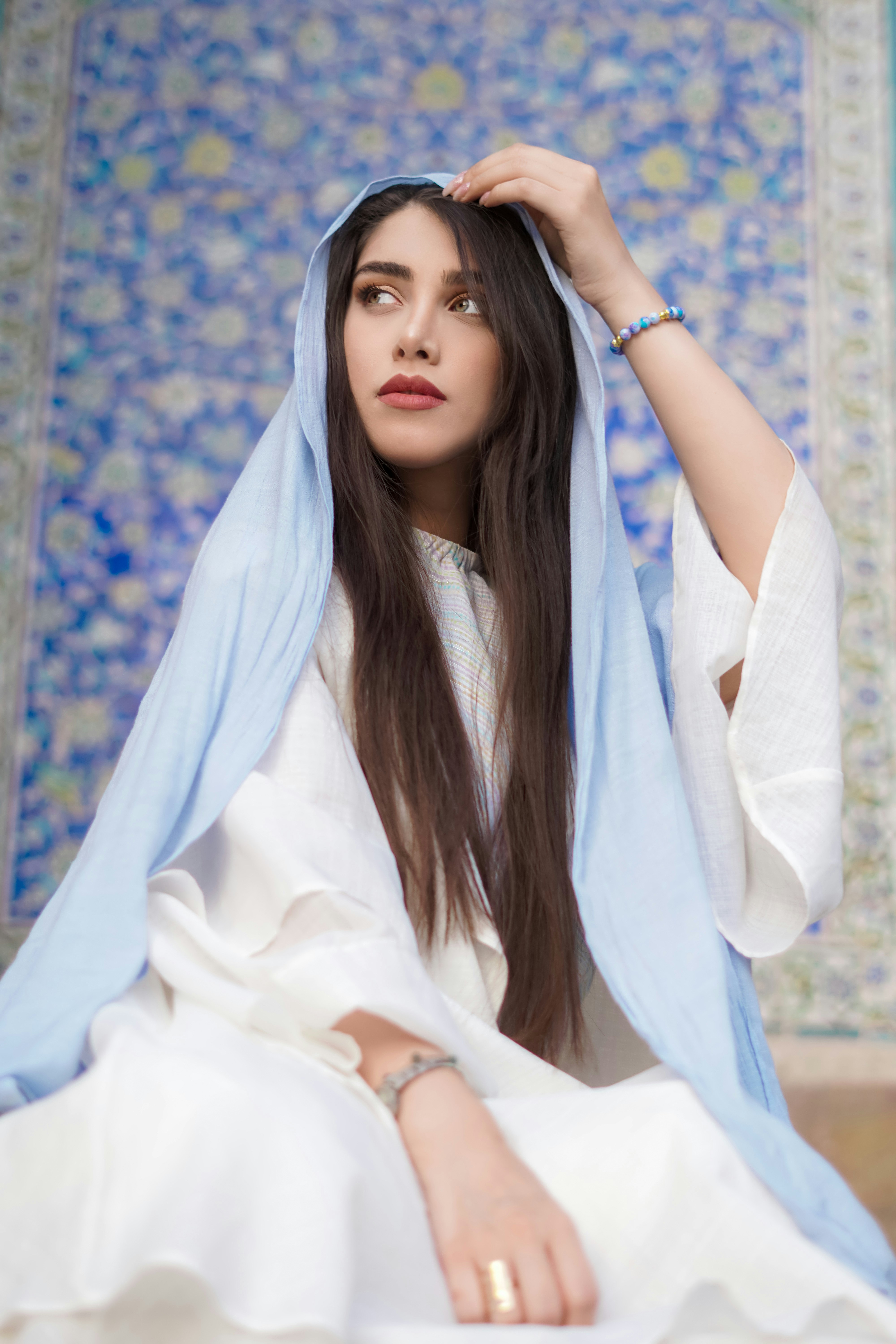 Veiled Quiet: Portrait Amid a Mosaic of Blues