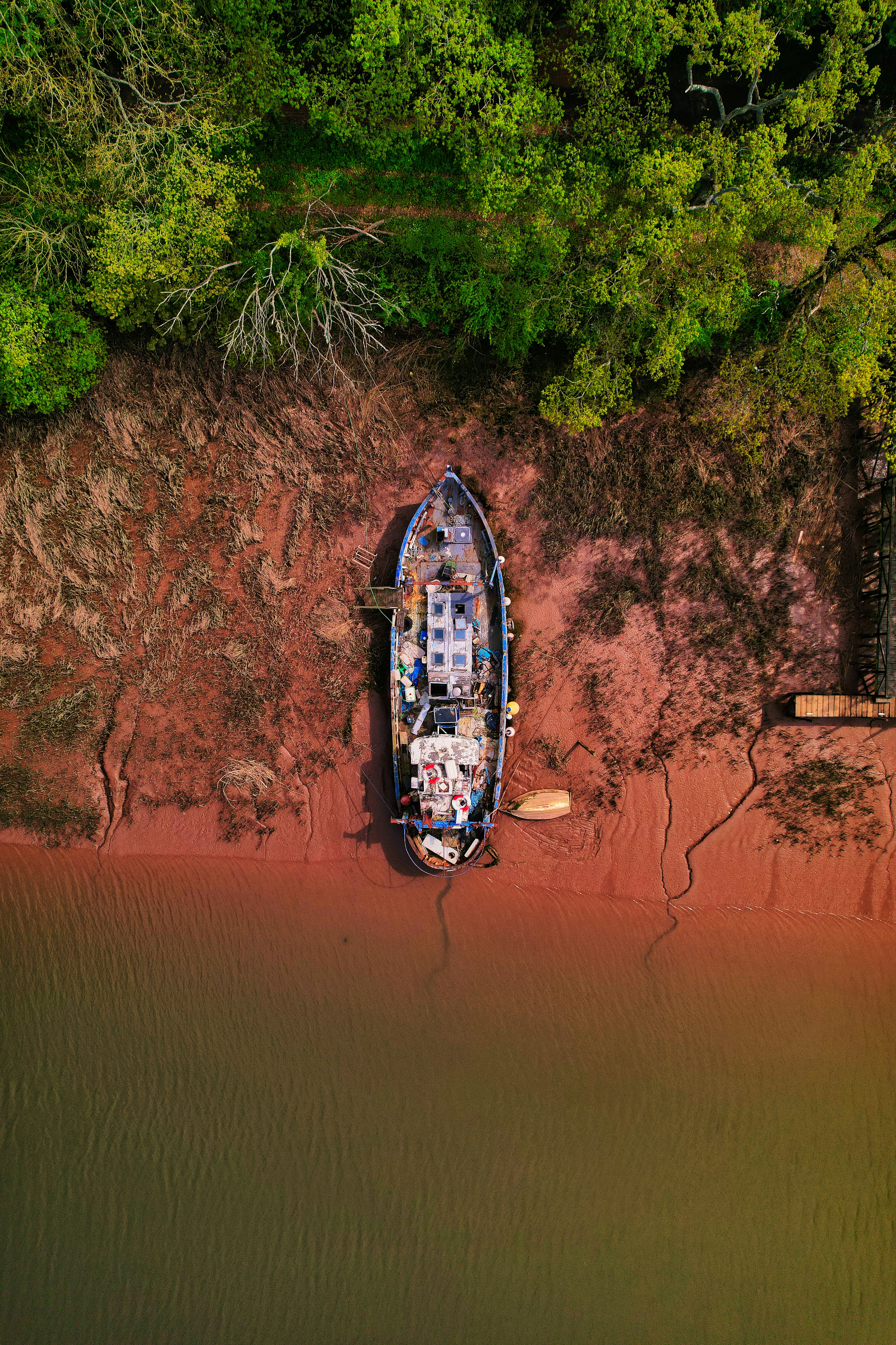 Cast Away. A neglected, ageing boat, on the banks of the Exe Estuary, Devon, UK