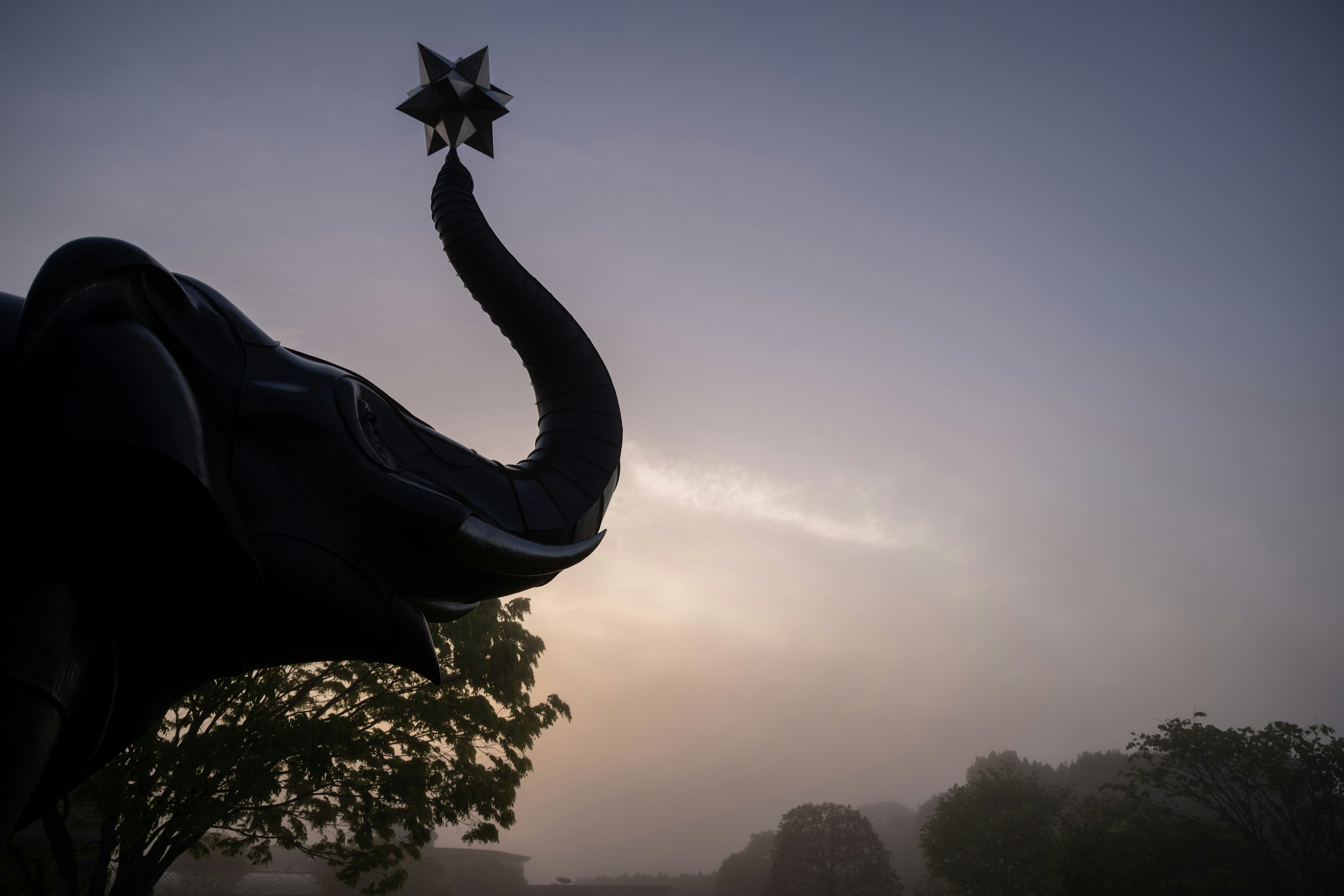 Star-Tipped Trunk Dawn: Silhouette of the Elephant Monument