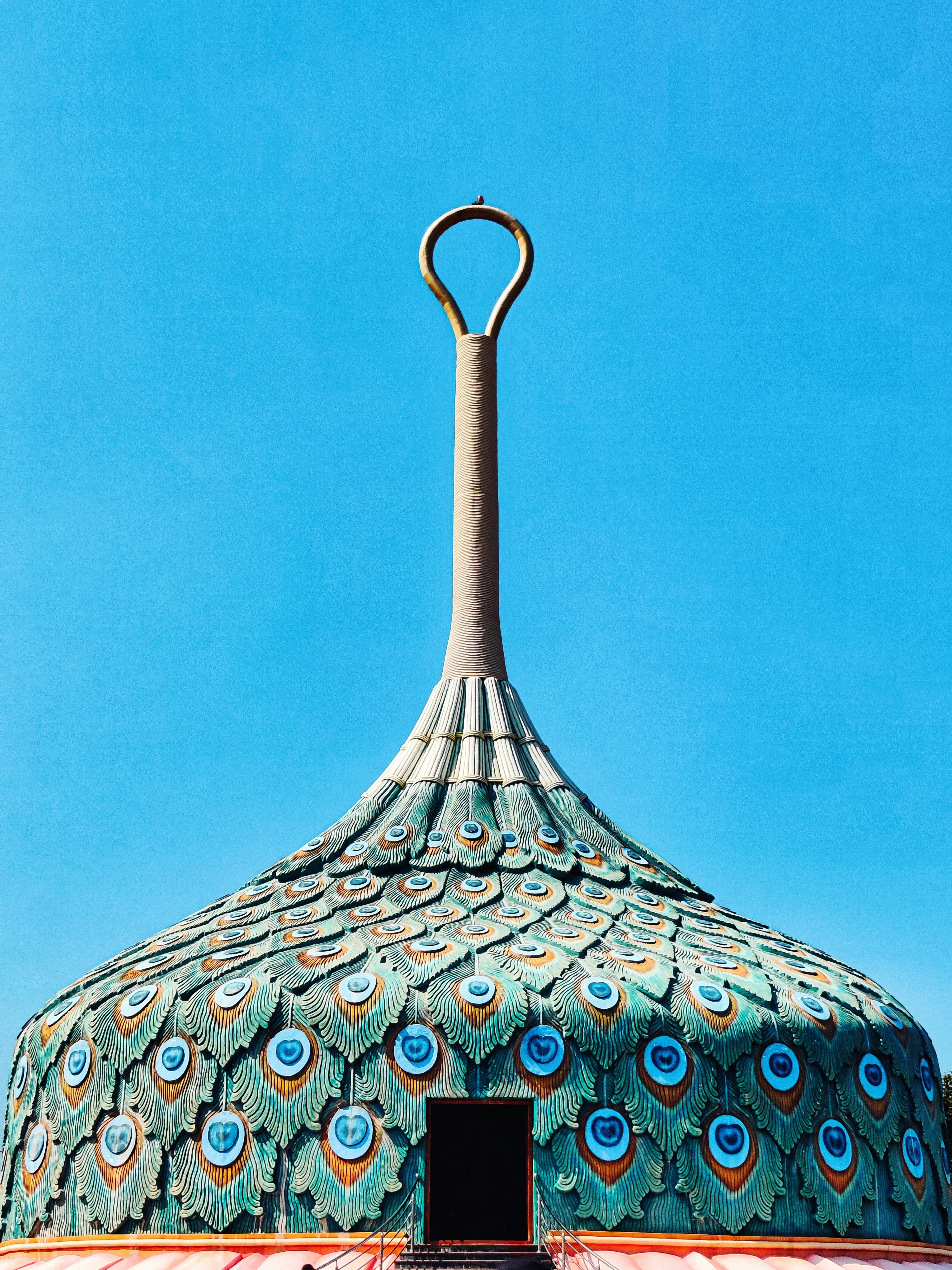 Azure Peacock-Dome Against a Sky-Blue Canvas